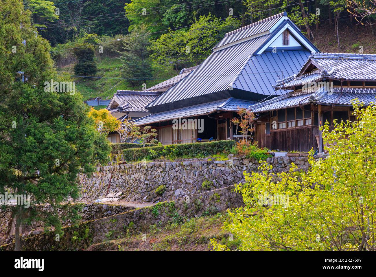 Traditional Japanese house on stone terrace in mountain village Stock ...