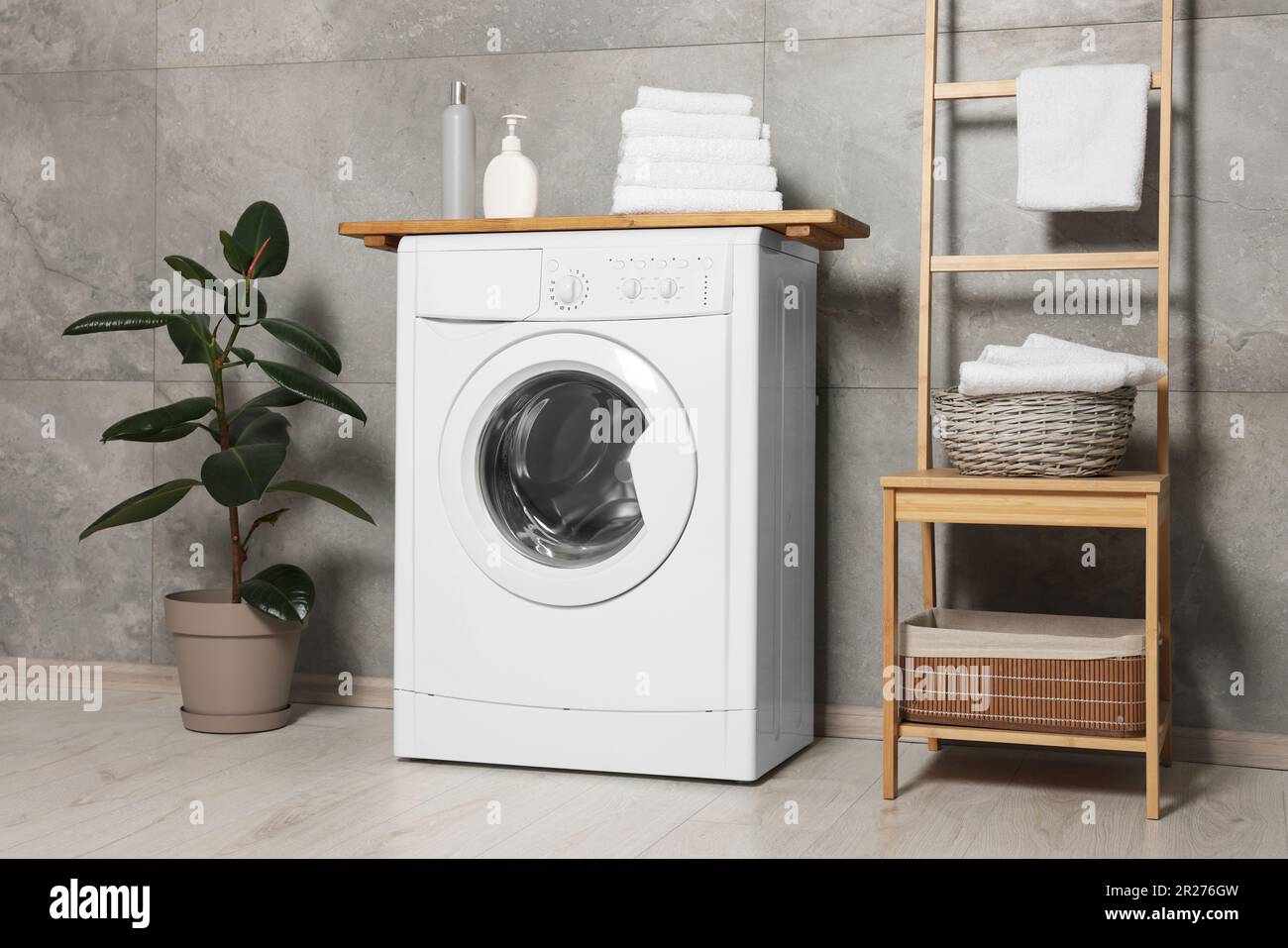 Stylish laundry room with modern washing machine. Interior design Stock ...