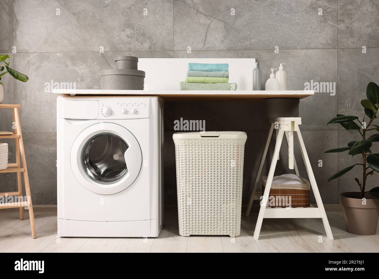 Stylish laundry room with modern washing machine. Interior design Stock ...