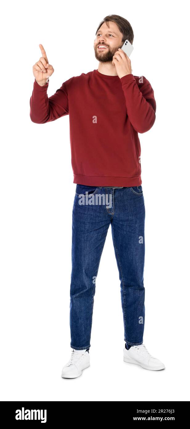Man talking on smartphone against white background Stock Photo - Alamy