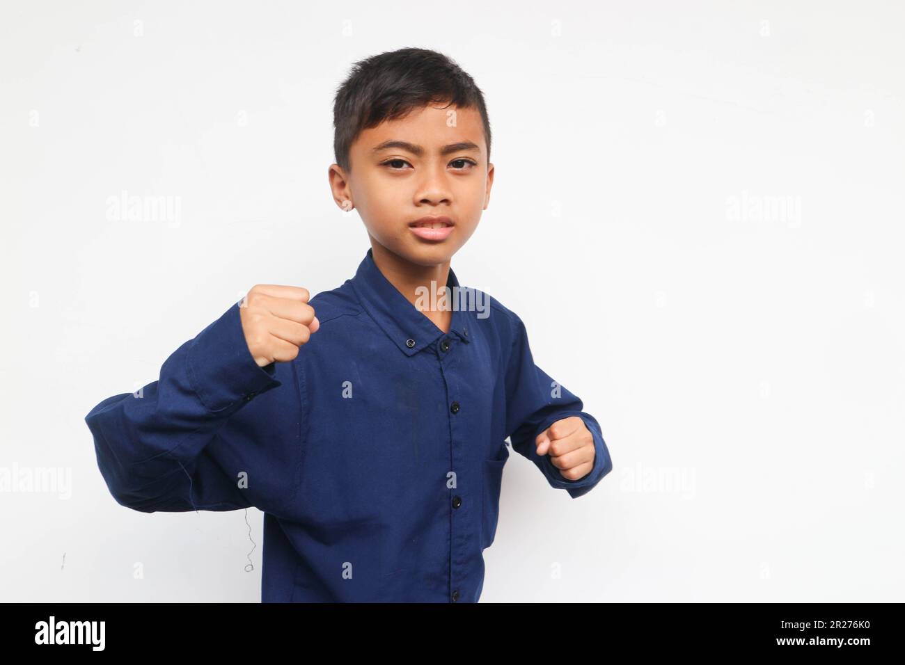 Boys demonstrating fighting gestures during martial arts training Stock Photo - Alamy