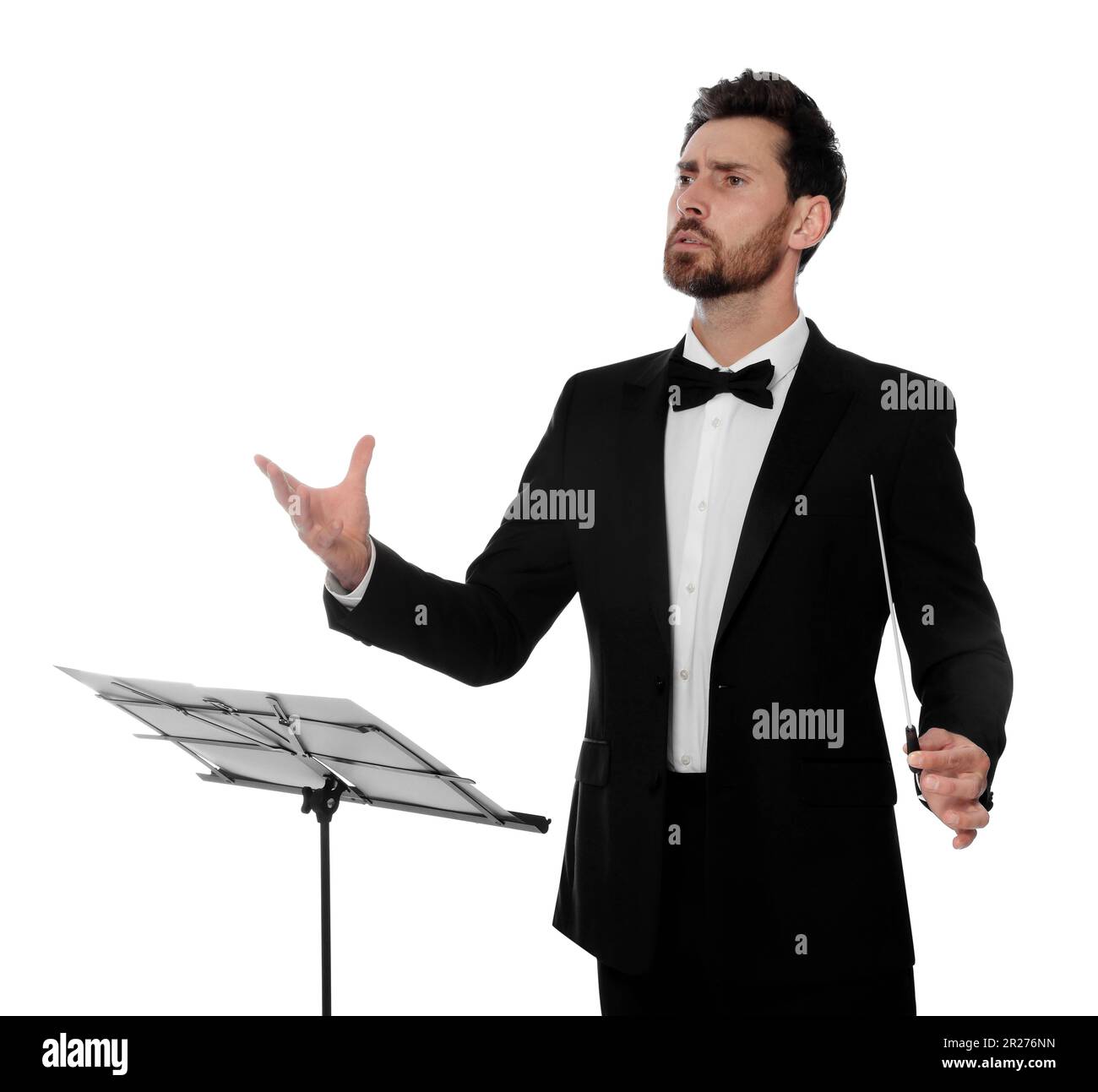 Professional conductor with baton and note stand on white background ...
