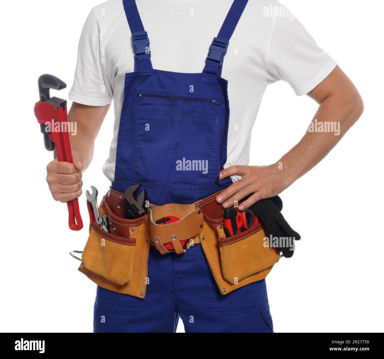 Professional plumber with pipe wrench and tool belt on white background ...