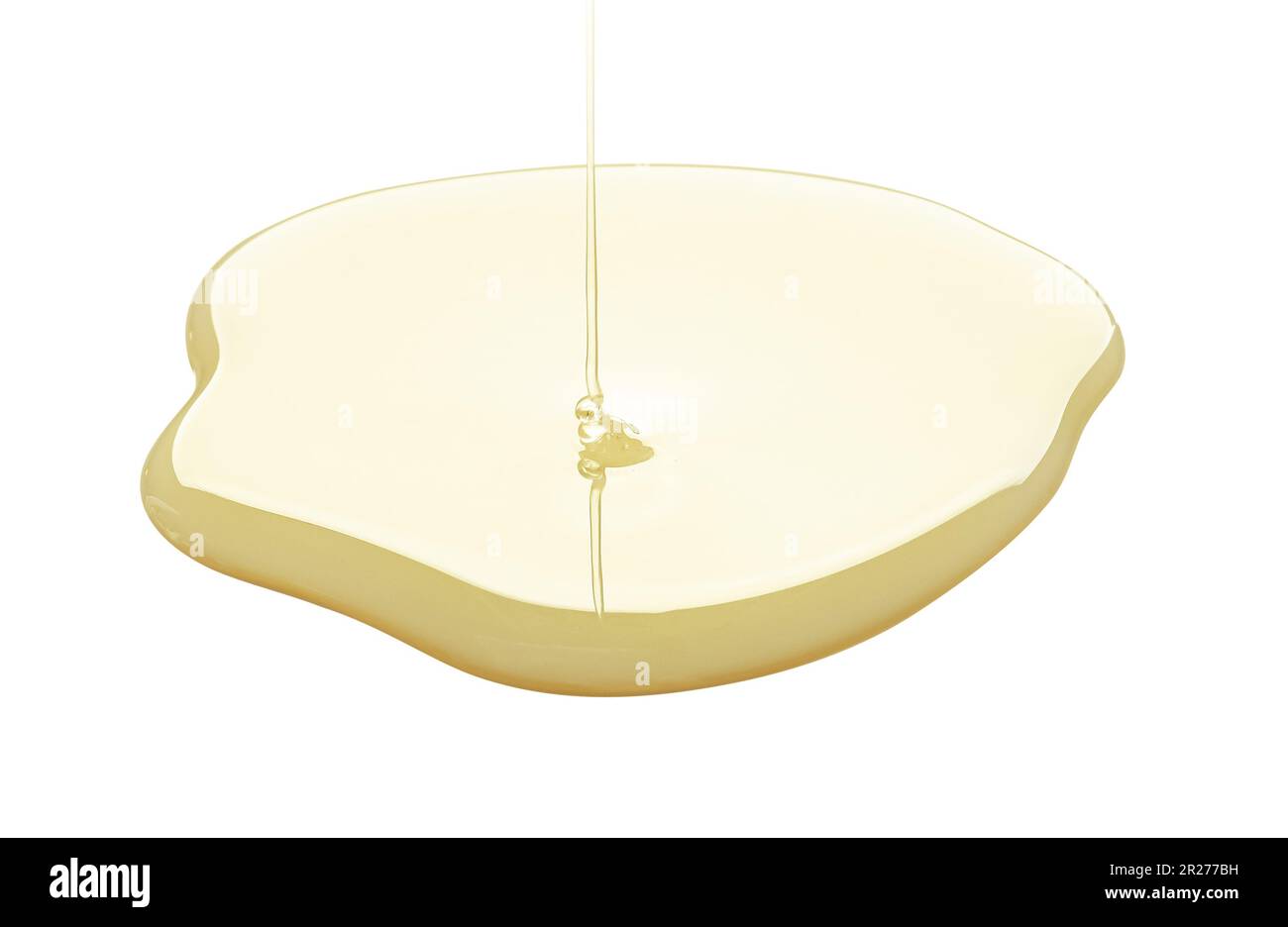 Vegetable oil pouring to puddle on white background Stock Photo - Alamy