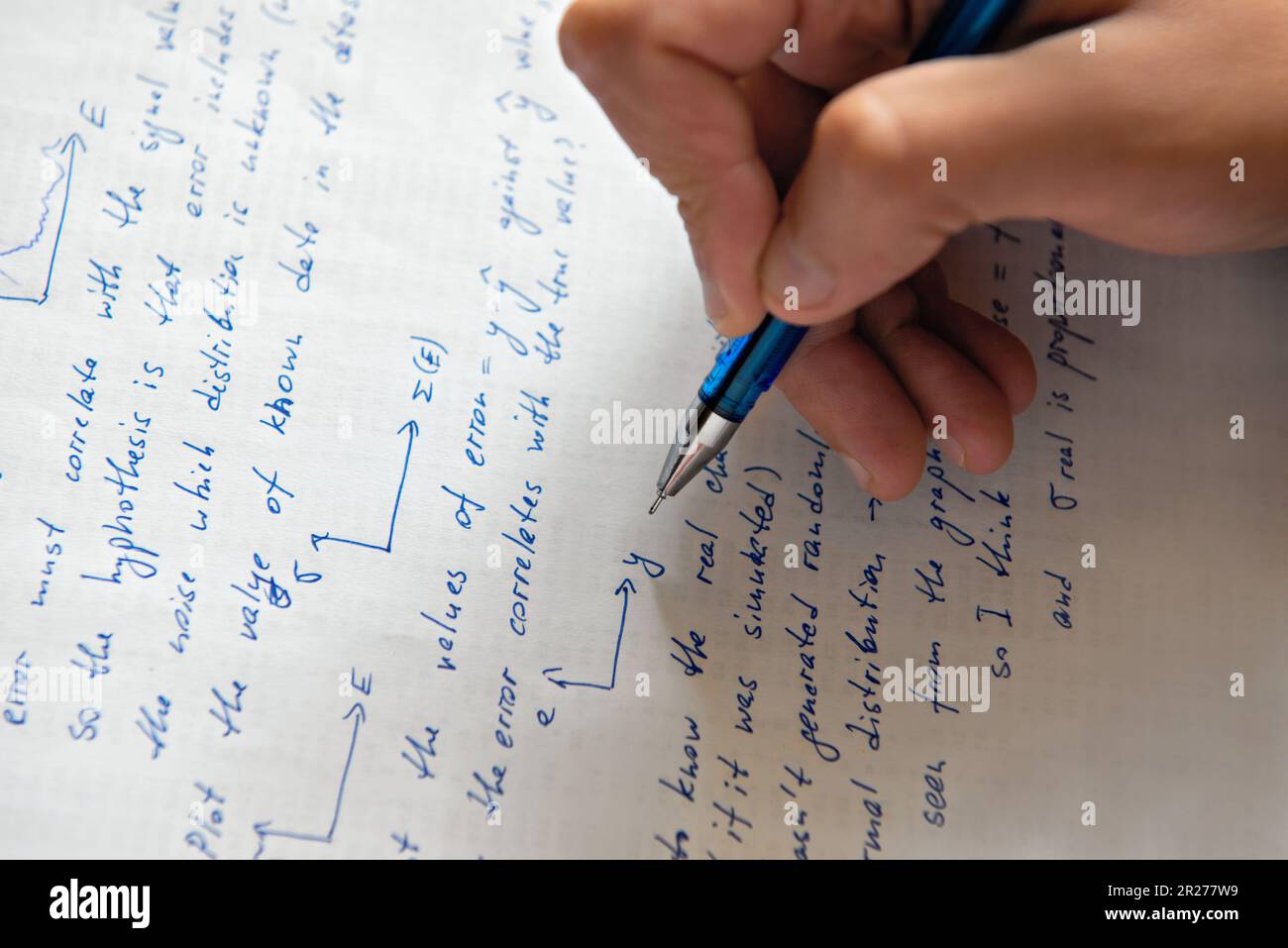 Student writing mathematical calculations on paper, closeup Stock Photo ...