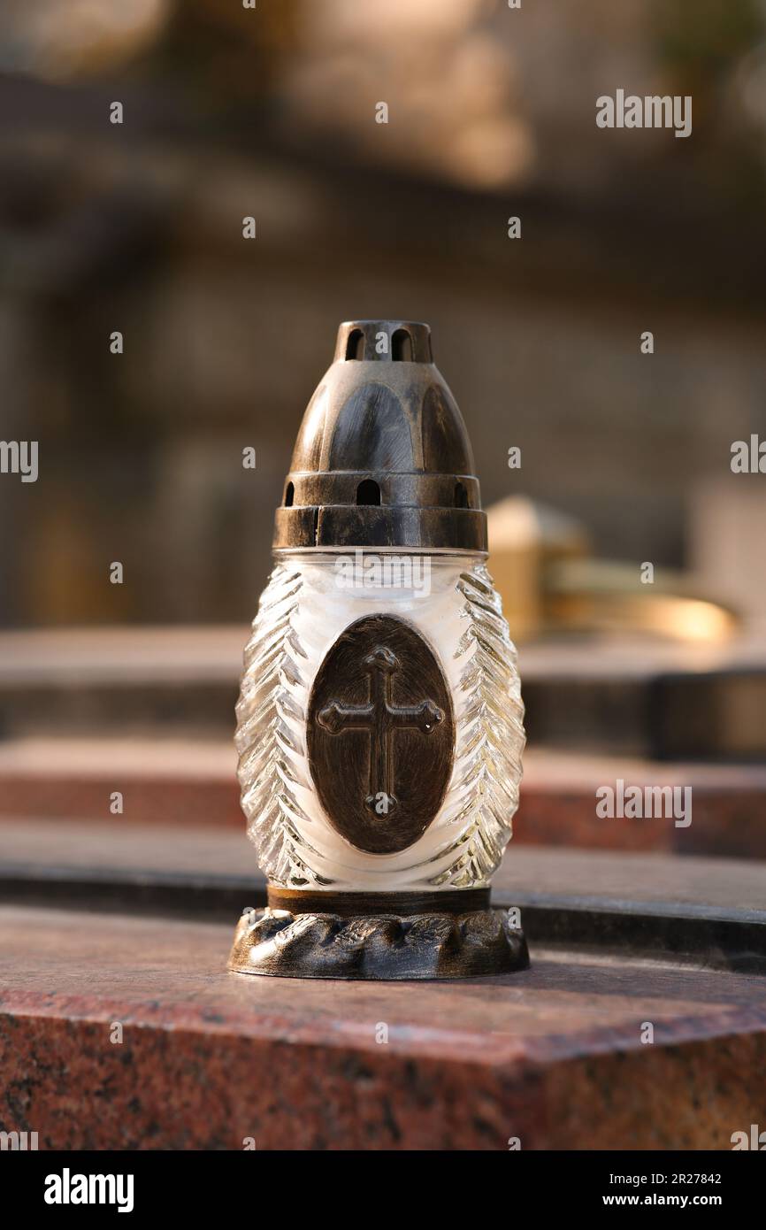 Grave lantern on granite surface in cemetery Stock Photo - Alamy