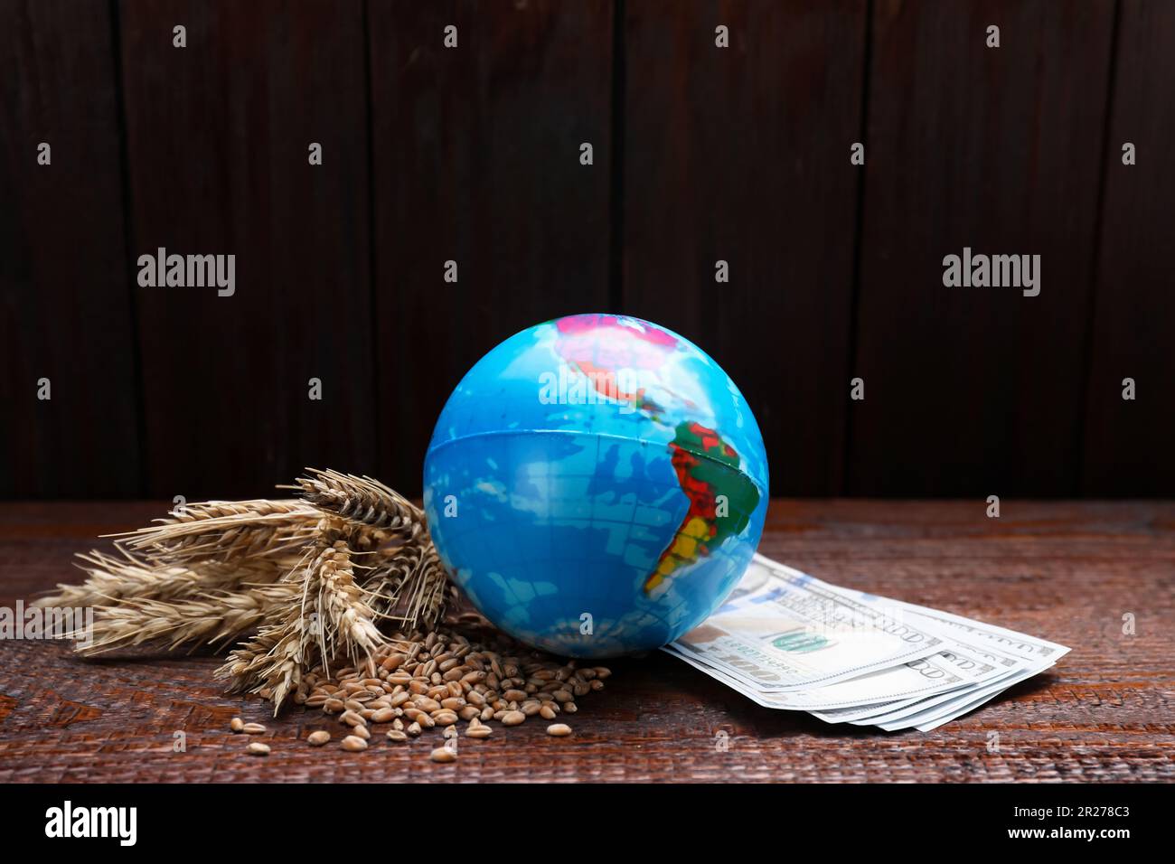 Globe, ears of wheat and banknotes on wooden table. Import and export ... Globe, ears of wheat and banknotes on wooden table. Import and export ...