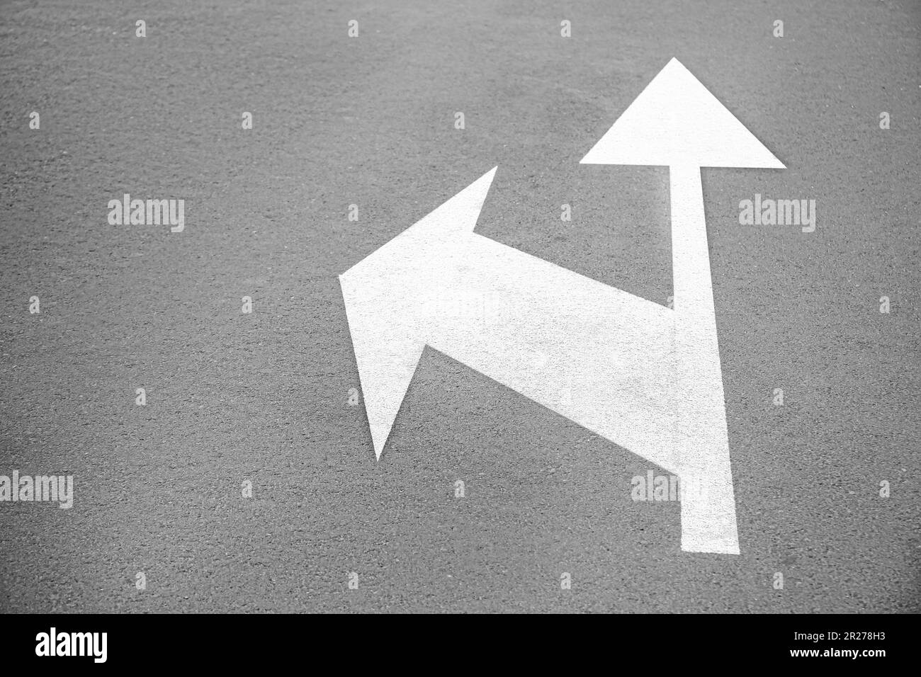 White painted arrow markings on road outdoors Stock Photo - Alamy