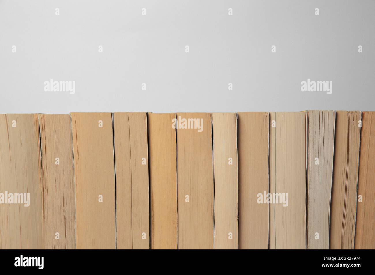 Collection of different books on light background, space for text Stock ...