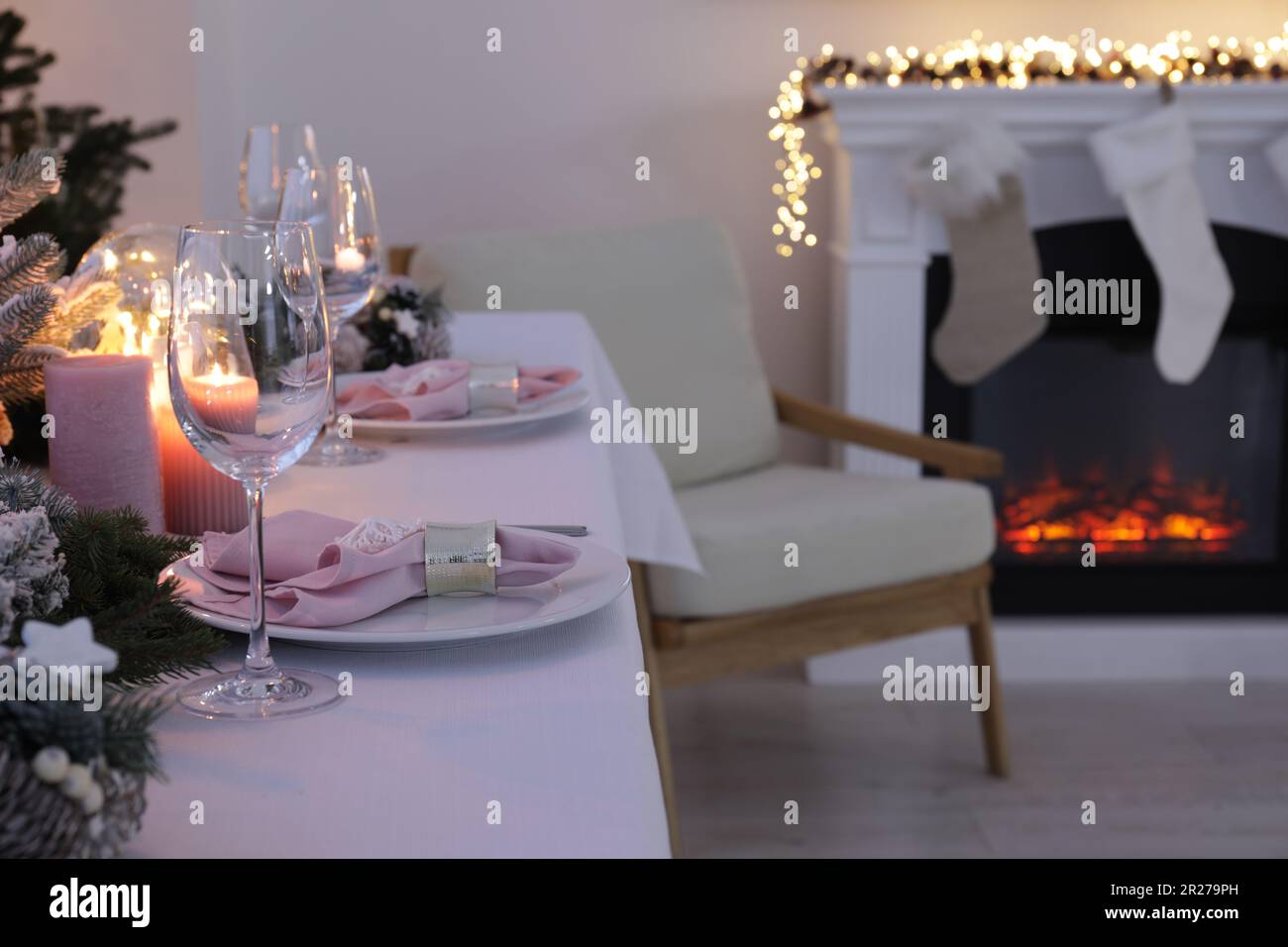 Beautiful festive table setting with Christmas decor in room, space for ...