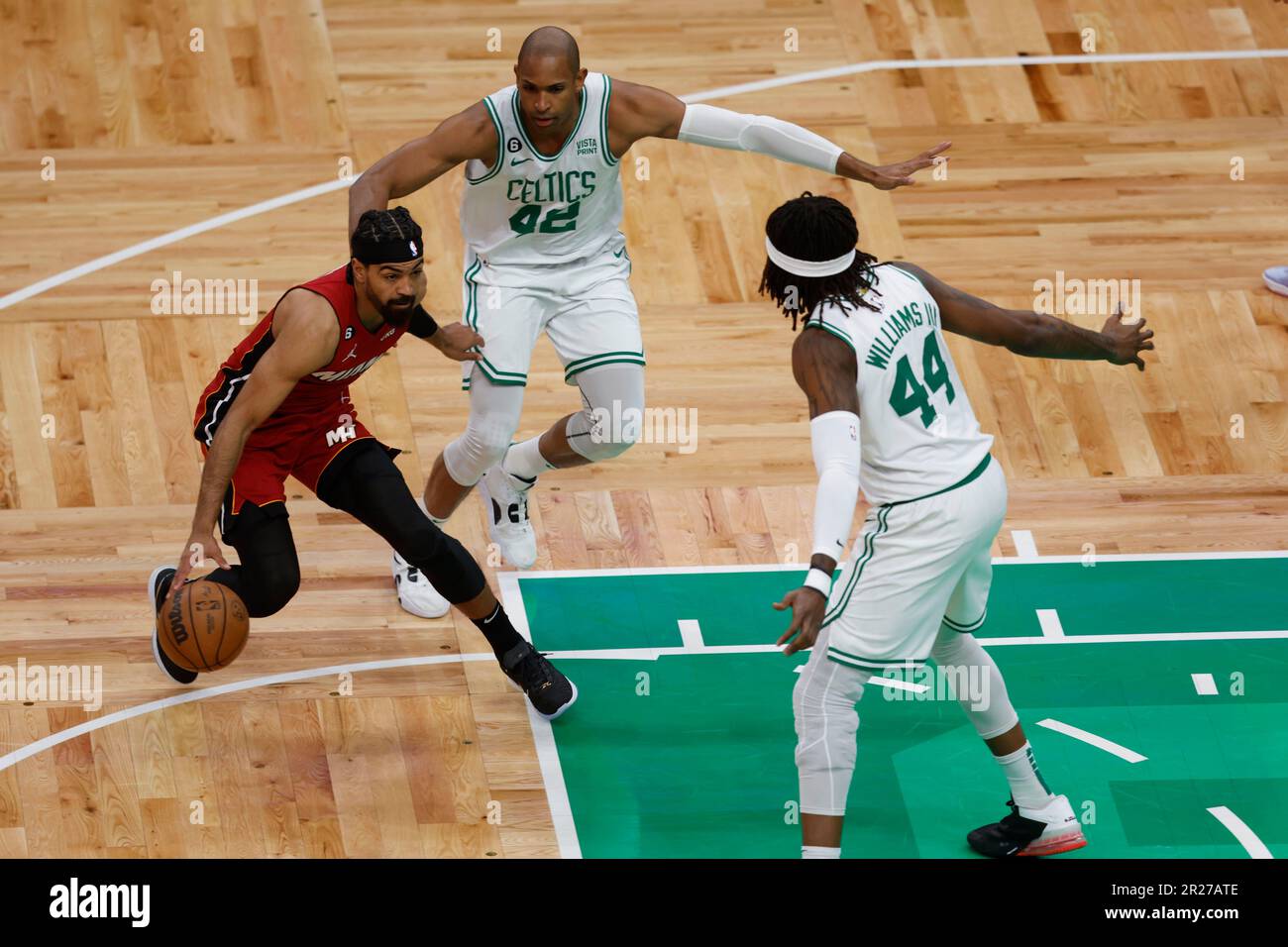 Miami Heat guard Gabe Vincent drives to the basket between Boston ...