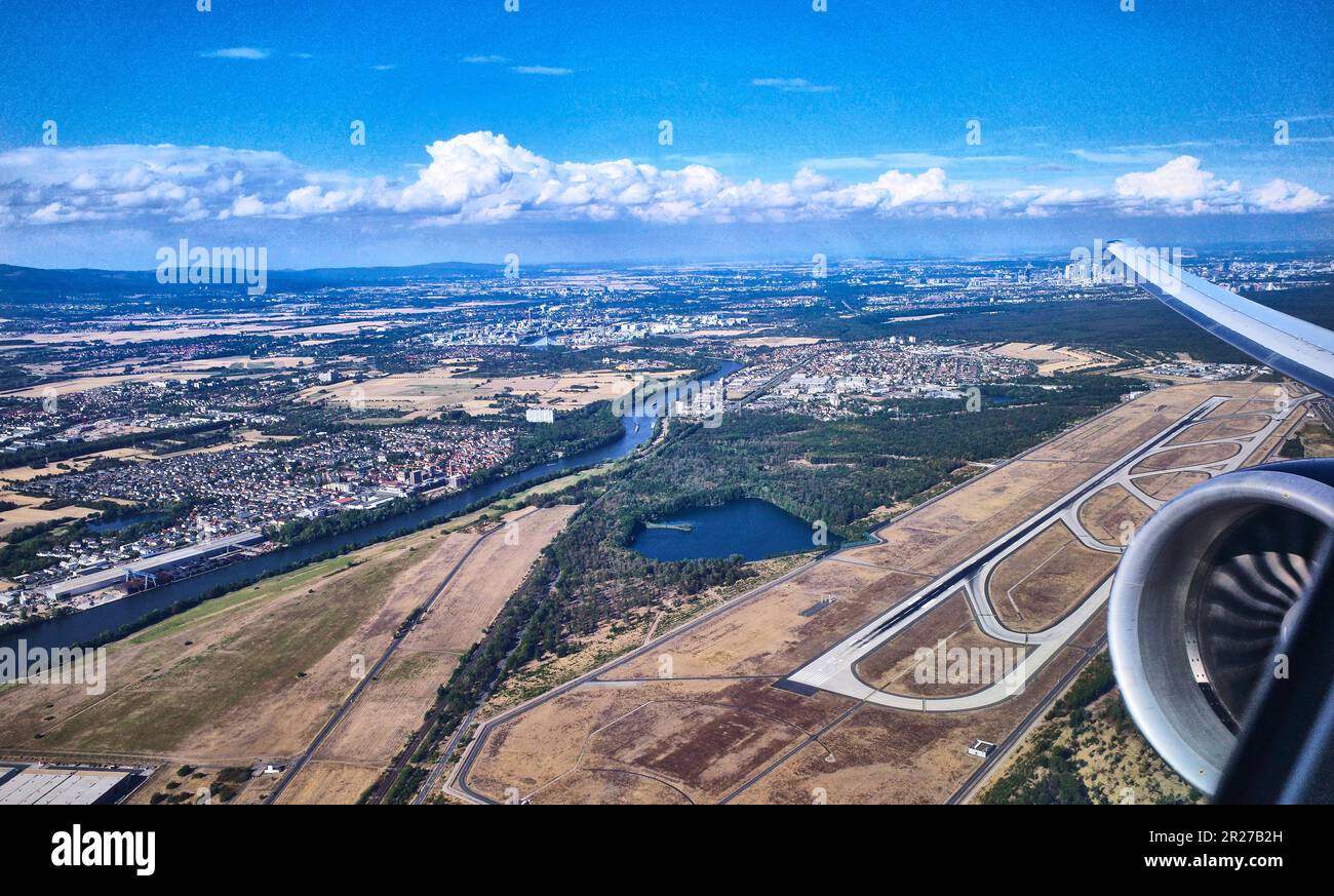 View from airplane after take-off showing landing strip, Main River ...