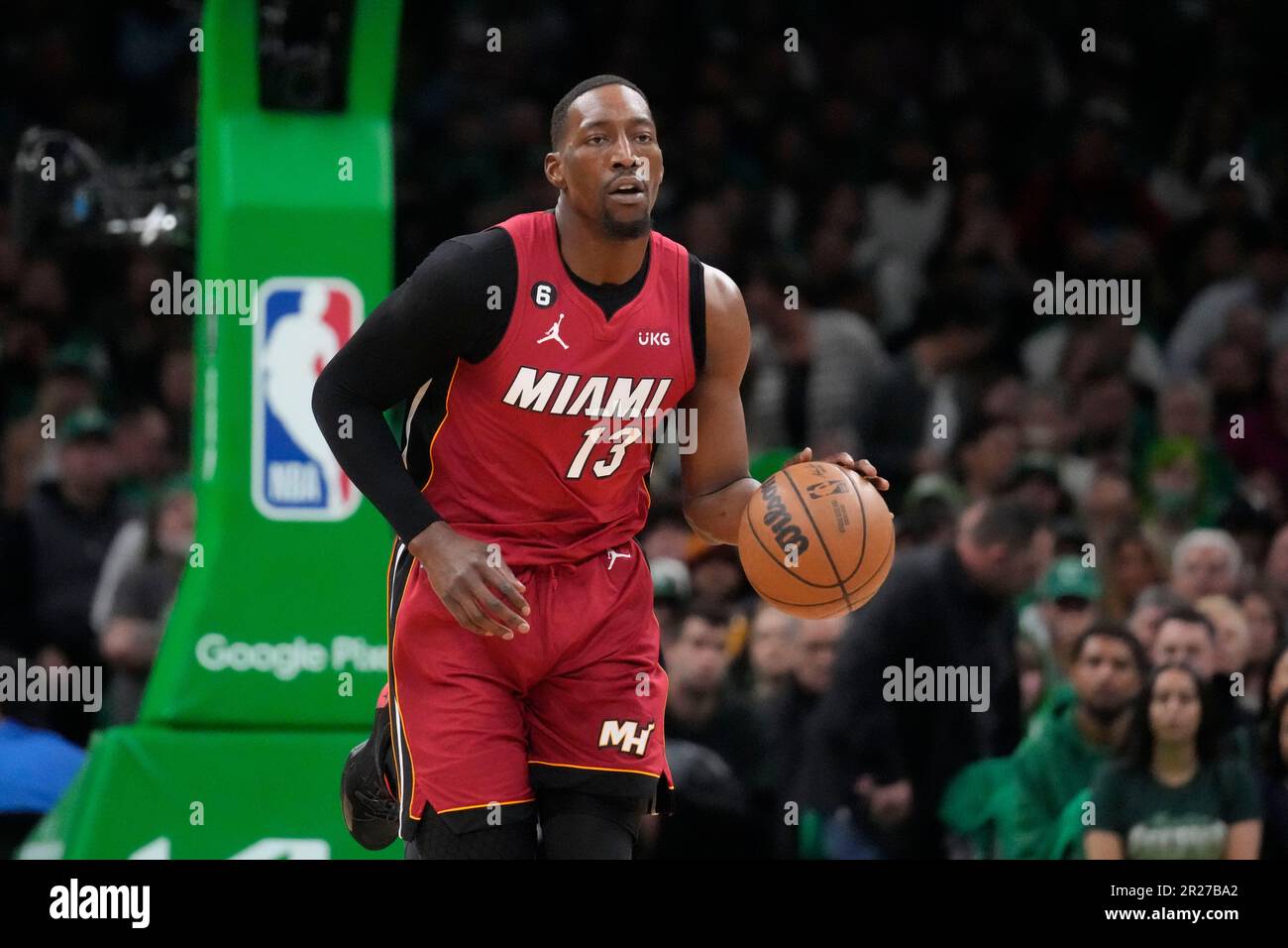 Miami Heat center Bam Adebayo (13) moves the ball down court in the ...