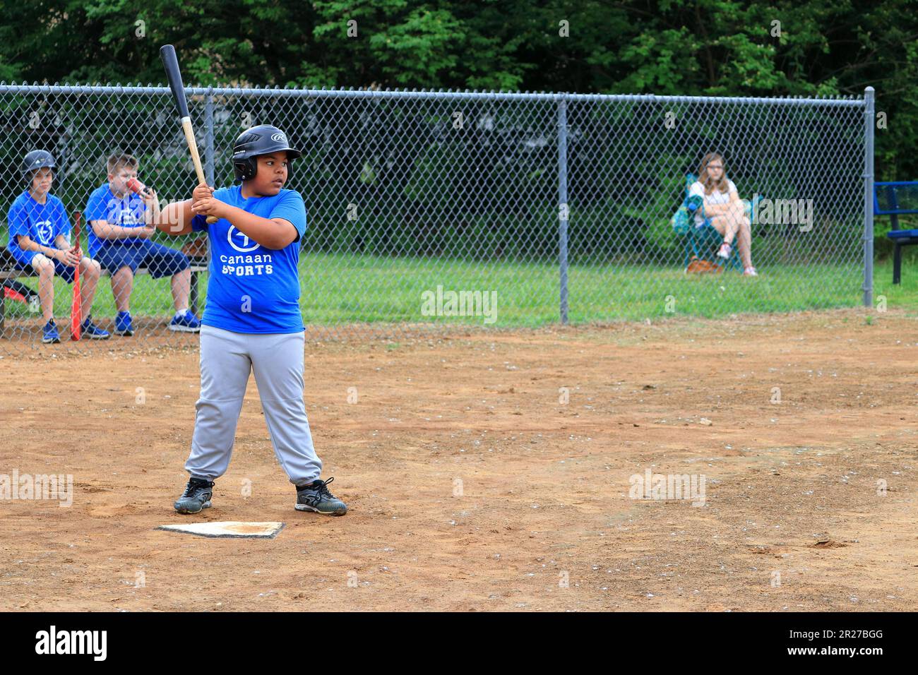 Kid Hitting Baseball