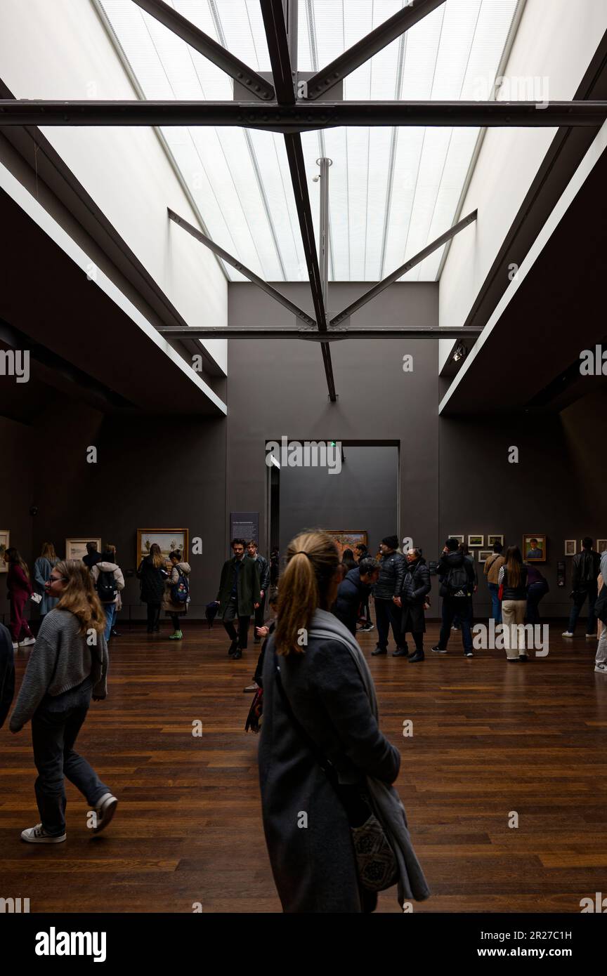 Unknown woman standing alone at the Orsay museum top floor gallery ...