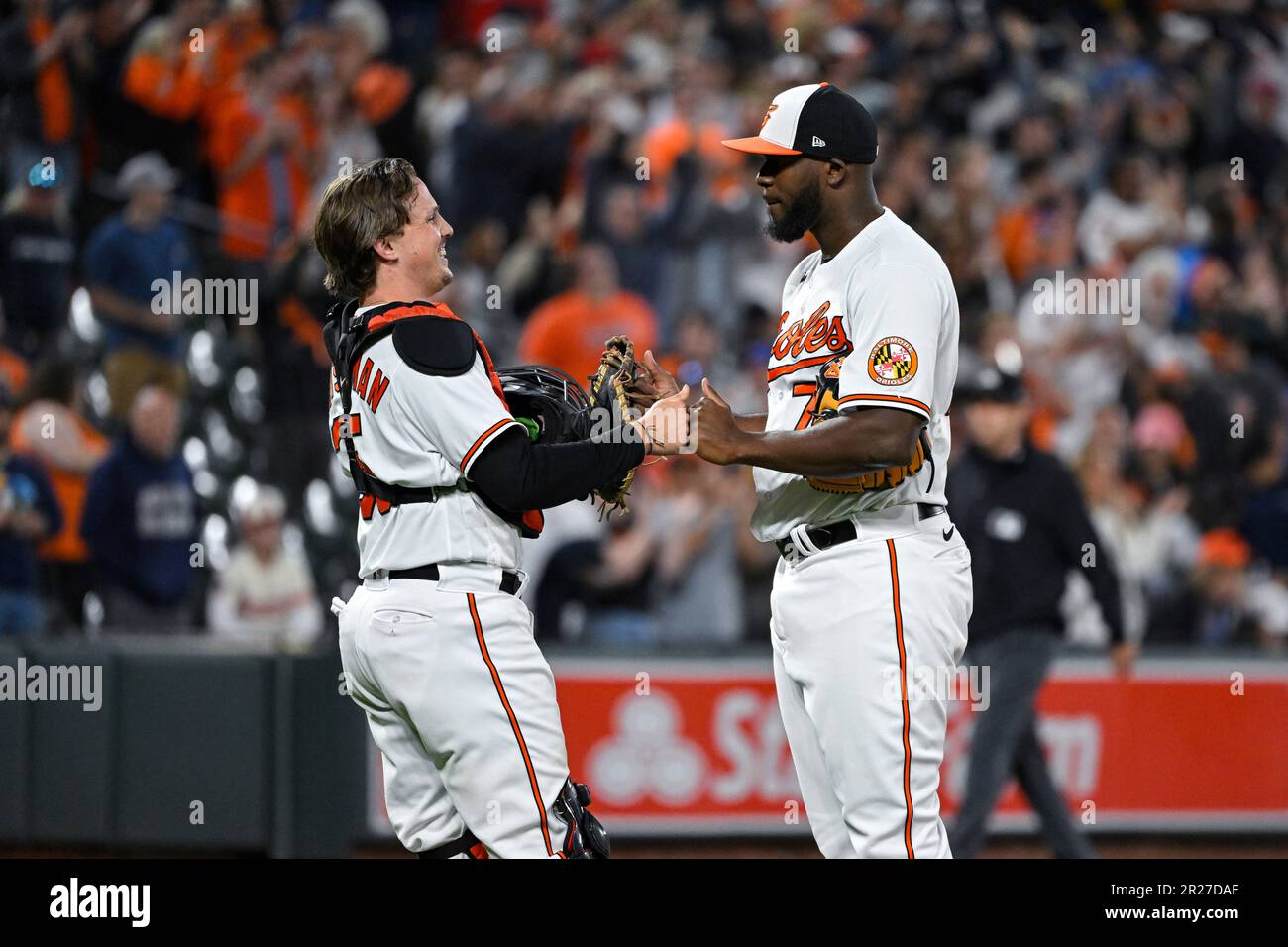 Baltimore Orioles catcher Adley Rutschman greets relief pitcher Felix ...