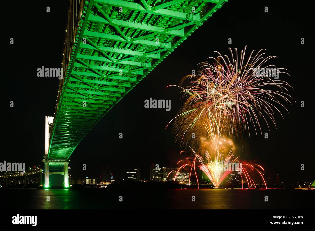 Odaiba Rainbow fireworks and looking up at Rainbow bridge Stock Photo ...