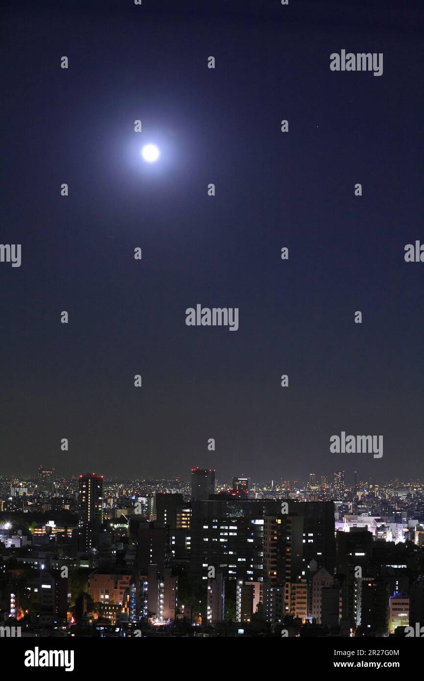 Moon and night view of Tokyo Stock Photo - Alamy