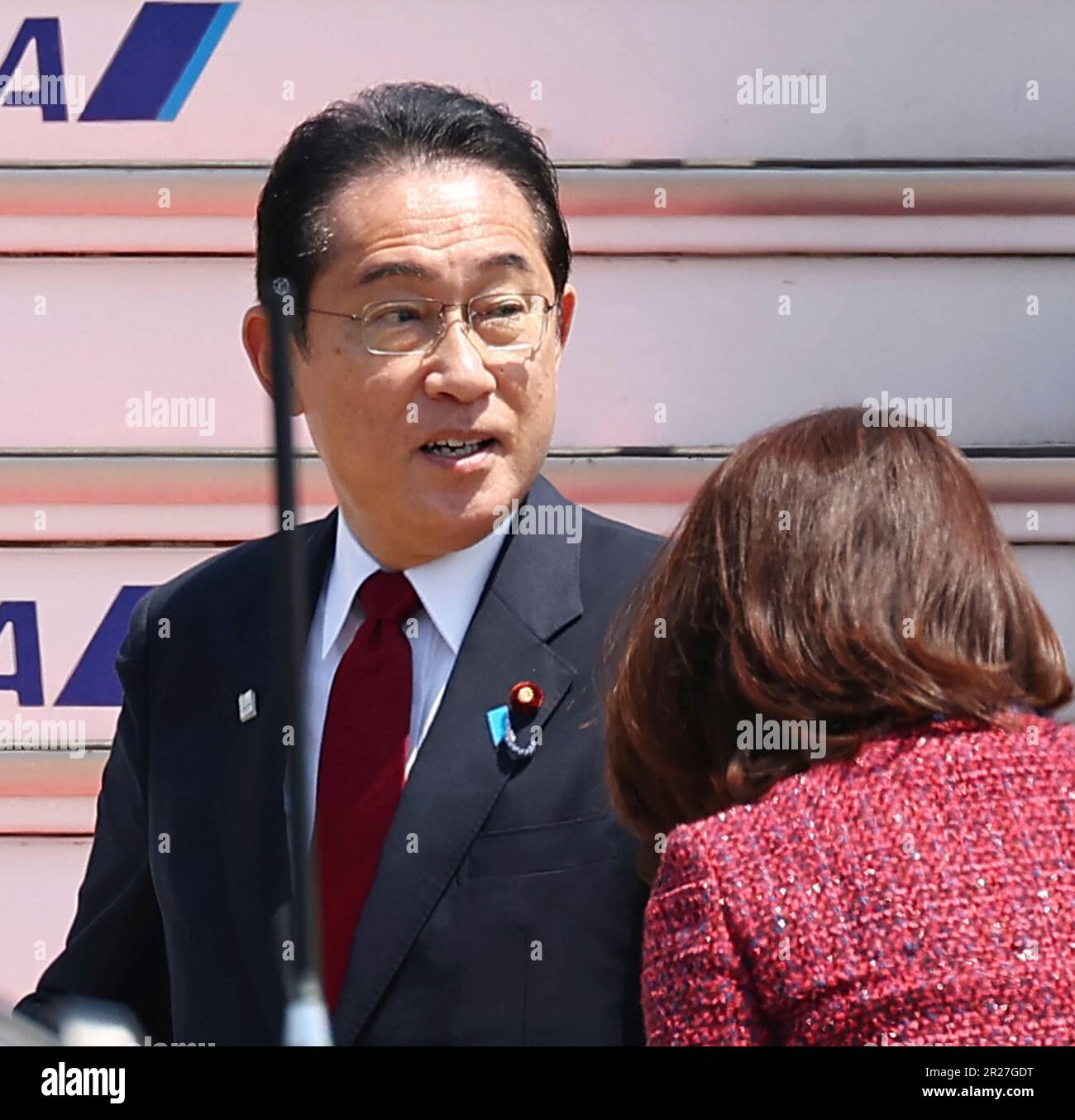 Japanese Prime Minister Fumio Kishida boards a government plane heading ...