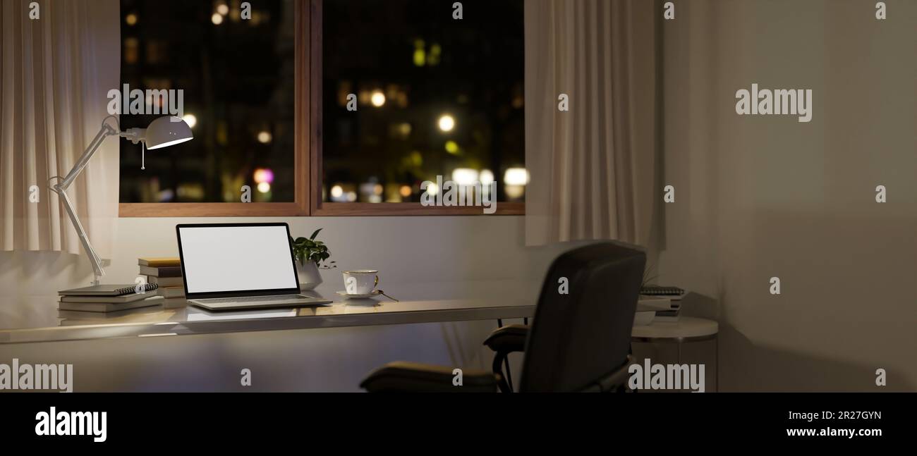Modern minimal home workspace at night with laptop computer blank ...