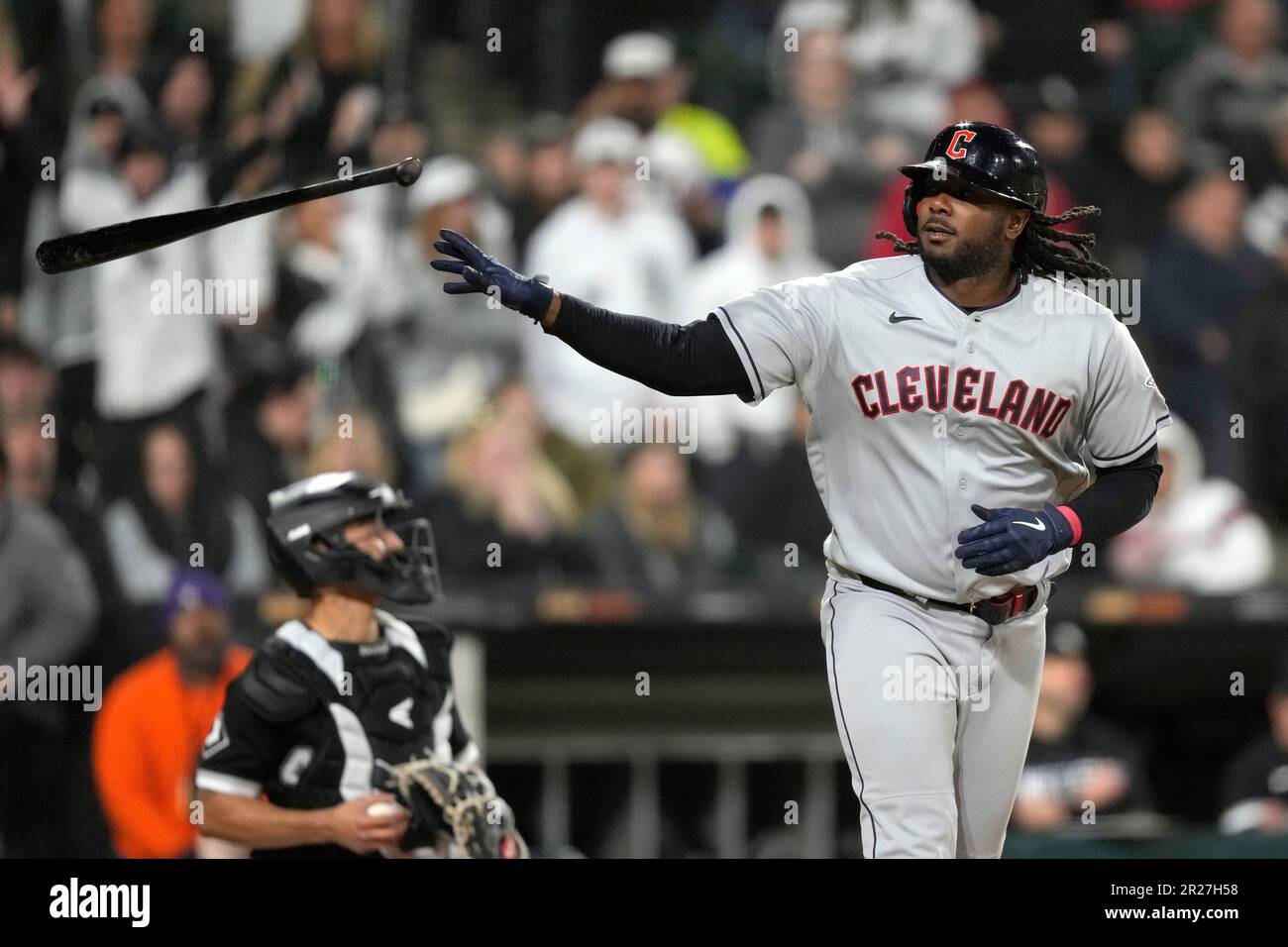 Cleveland Guardians' Josh Bell tosses his bat after drawing a walk from ...