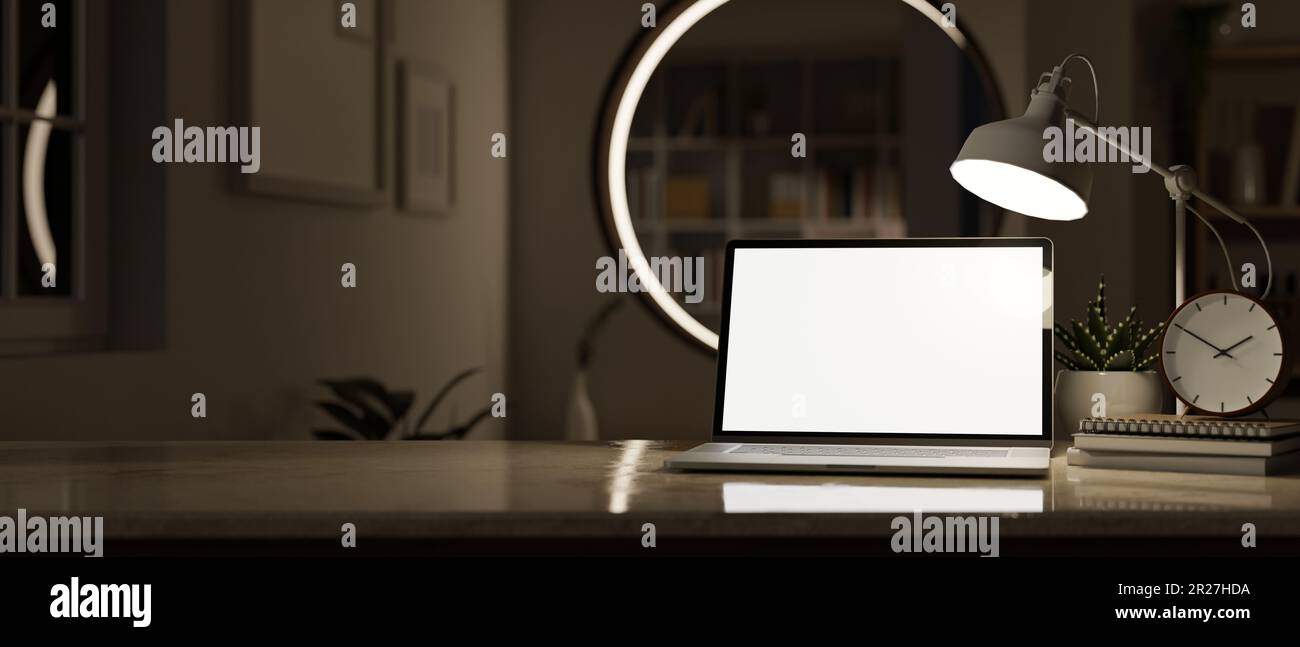 Close-up image of home workspace at night with laptop computer white ...