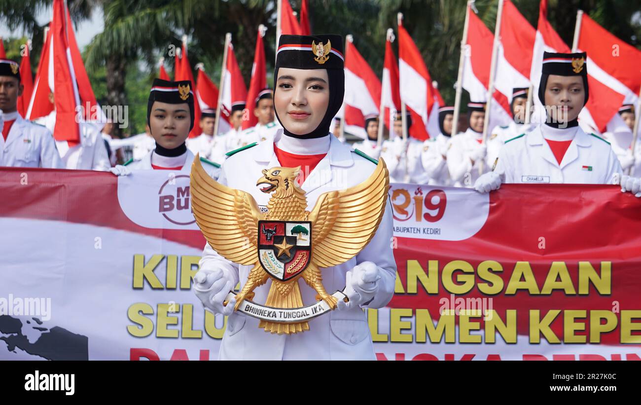 Indonesian holding Garuda Pancasila (Indonesian five principles Stock ...