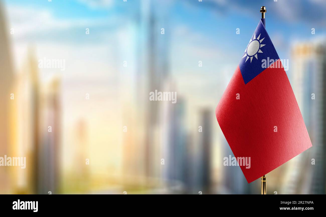 Small flags of the Taiwan on an abstract blurry background Stock Photo ...