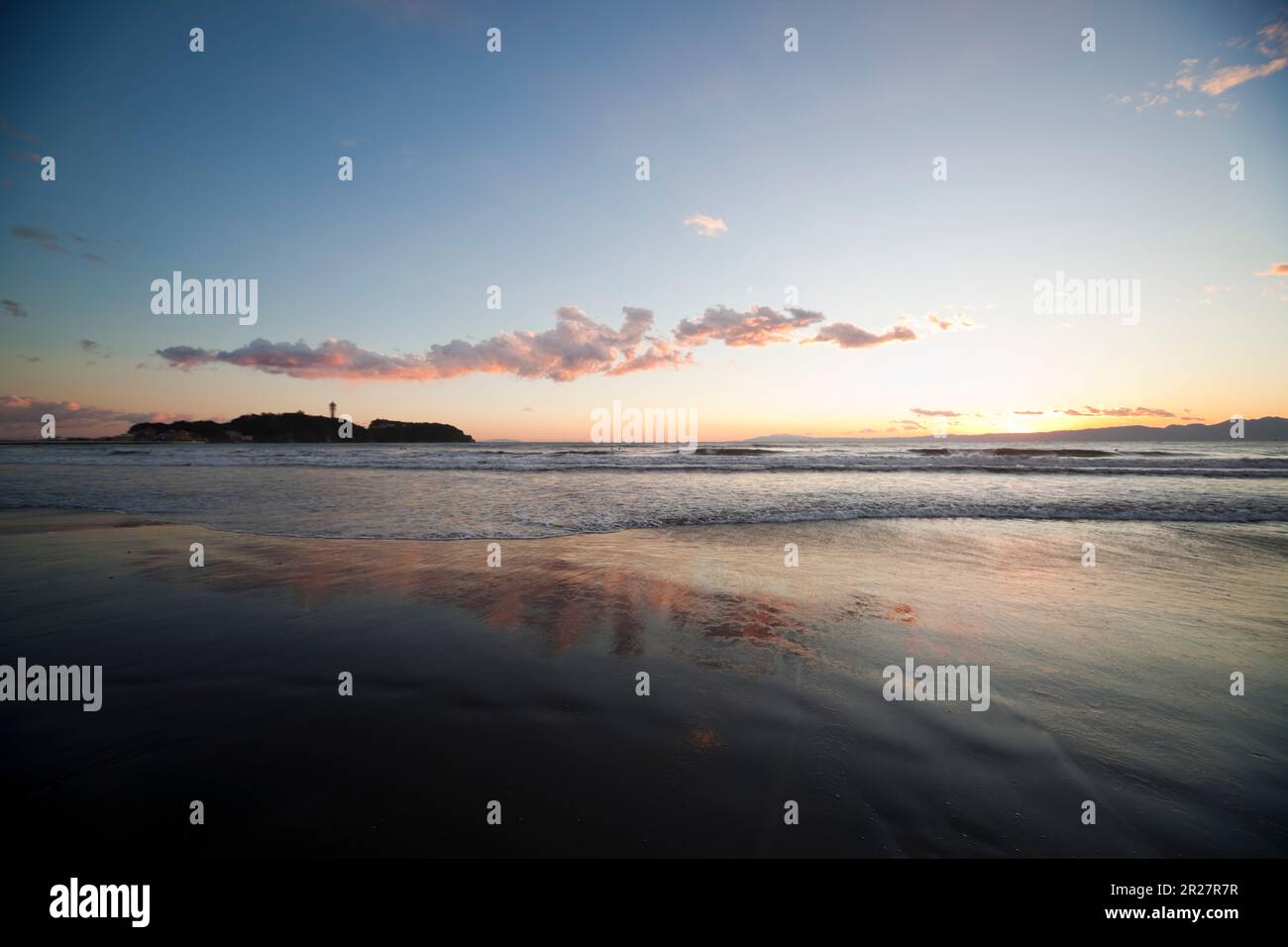 Beach and Enoshima at sunset Stock Photo - Alamy