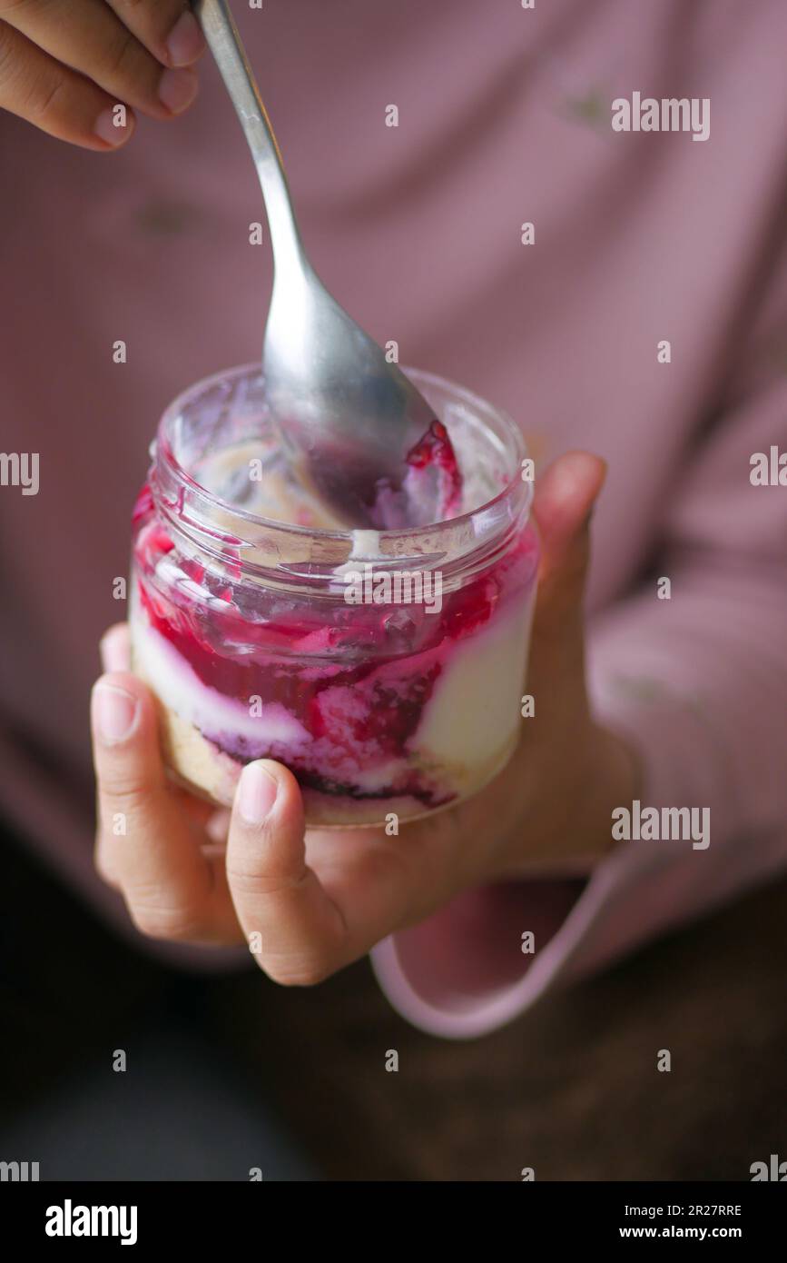 women eating chocolate pudding in a glass jar Stock Photo - Alamy