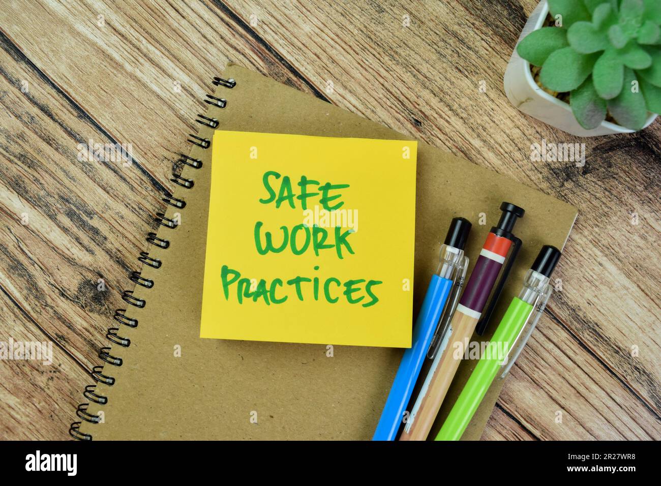 Concept of Safe Work Practices write on sticky notes isolated on Wooden ...
