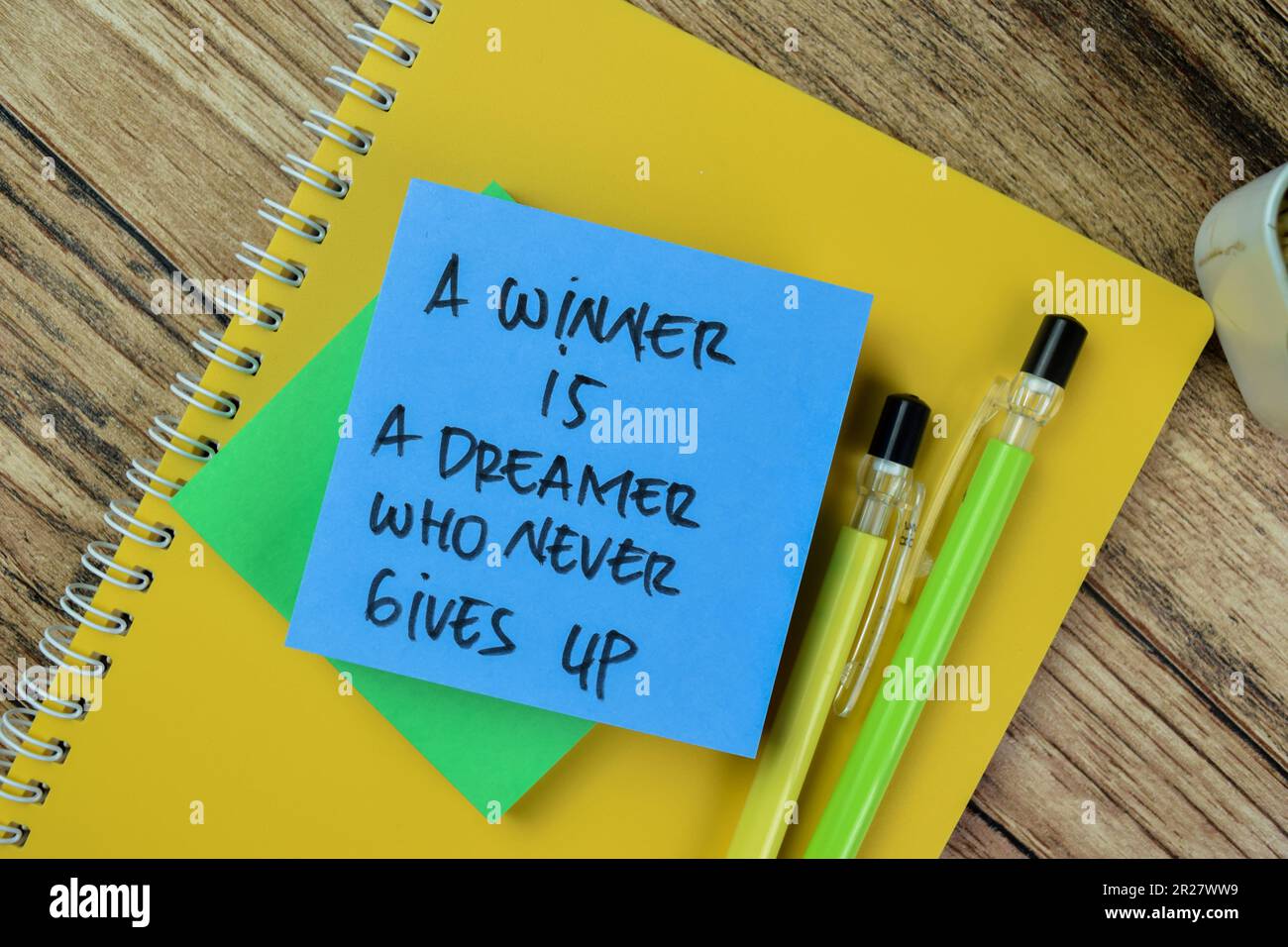 Concept of A Winner is A Dreamer Who Never Gives Up write on sticky ...