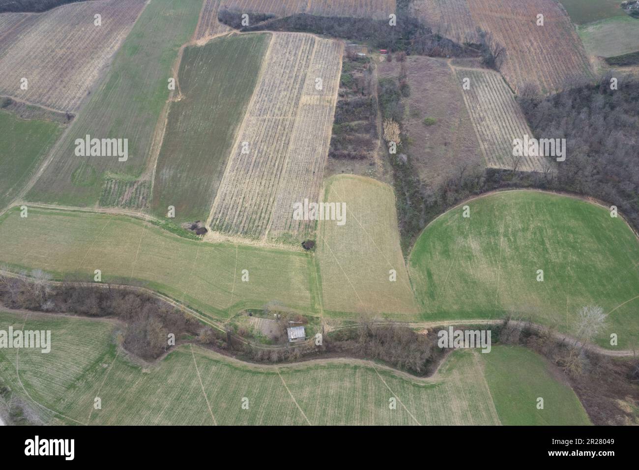 aerial panorama drone scenic of hills, vineyards and farms in Martani ...