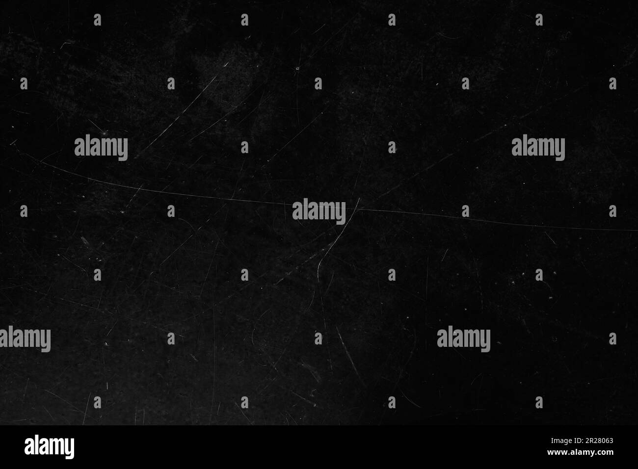 The scratched wall surface is painted black as a background coating for ...