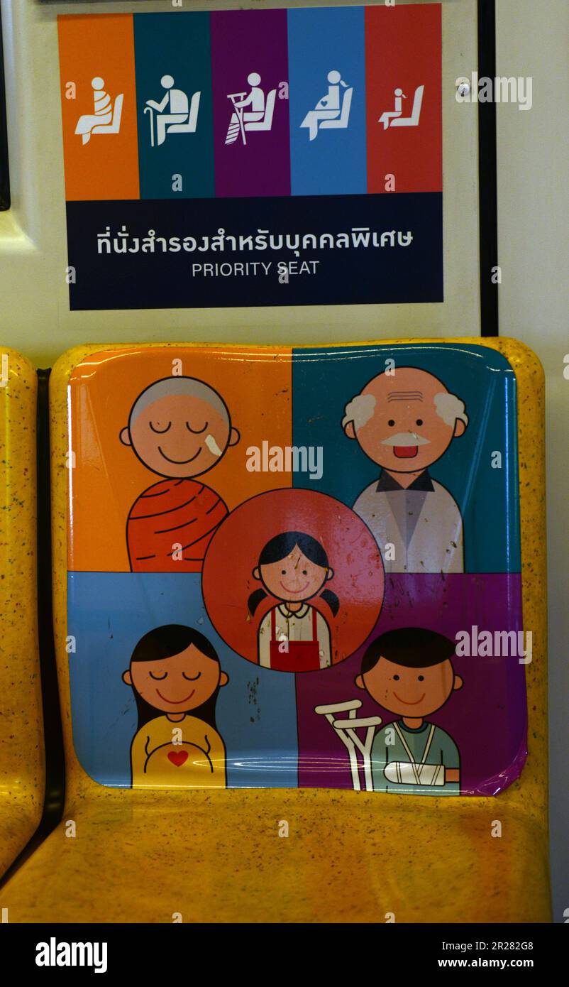 A priority seat sign on the BTS Skytrain in Bangkok, Thailand Stock ...