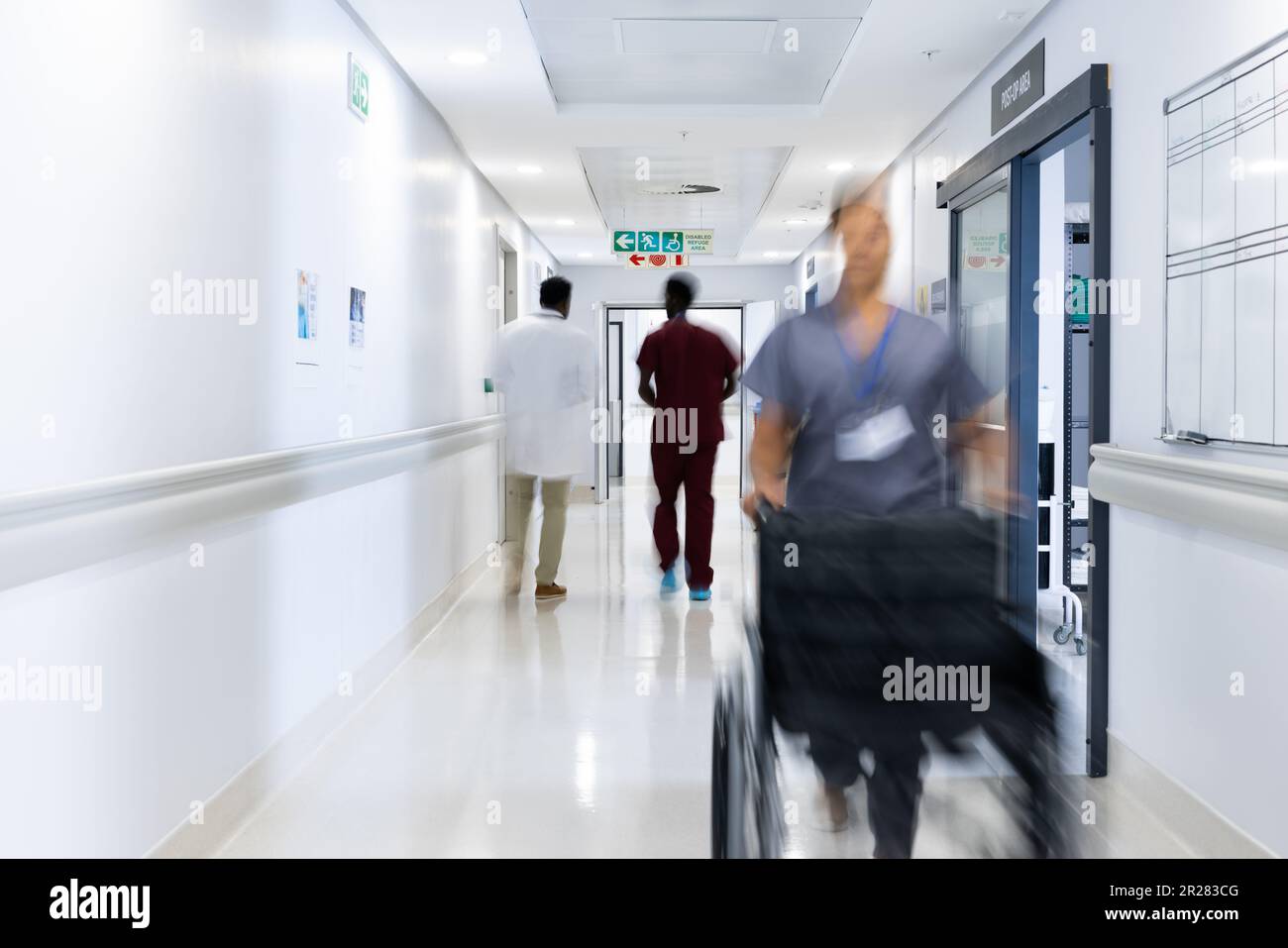 Hospital staff in corridor hi-res stock photography and images - Alamy