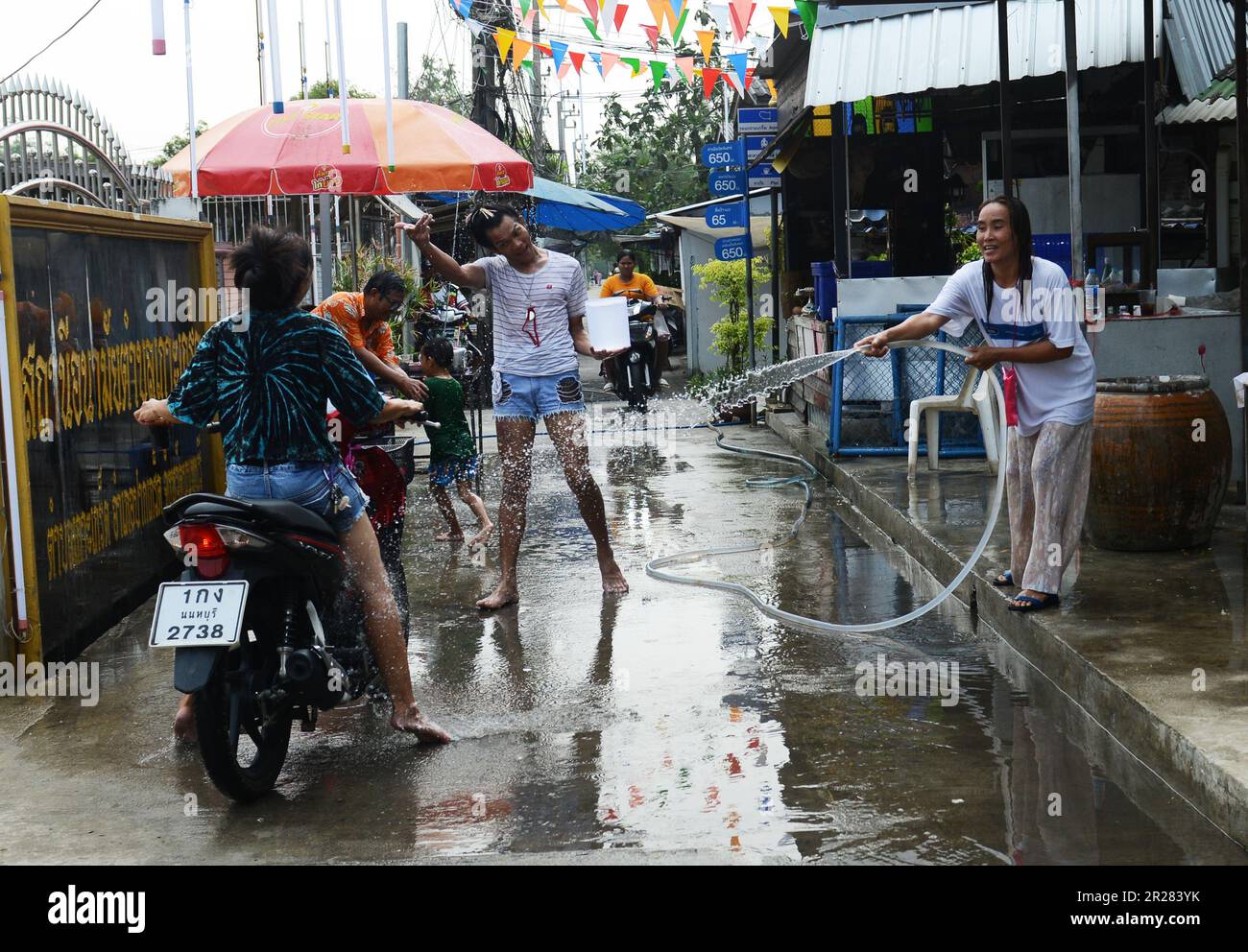 Water splashing celebration during Songkran ( Thai New Year ) on Koh Kret, Nonthaburi, Thailand ...