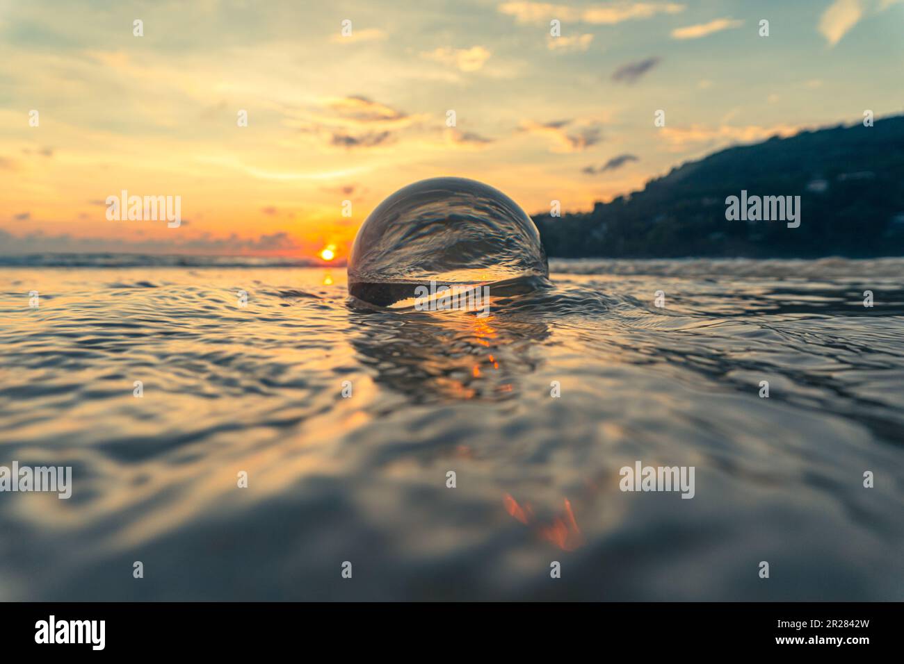 amazing view of beautiful sky at sunset inside crystal ball. colorful ...