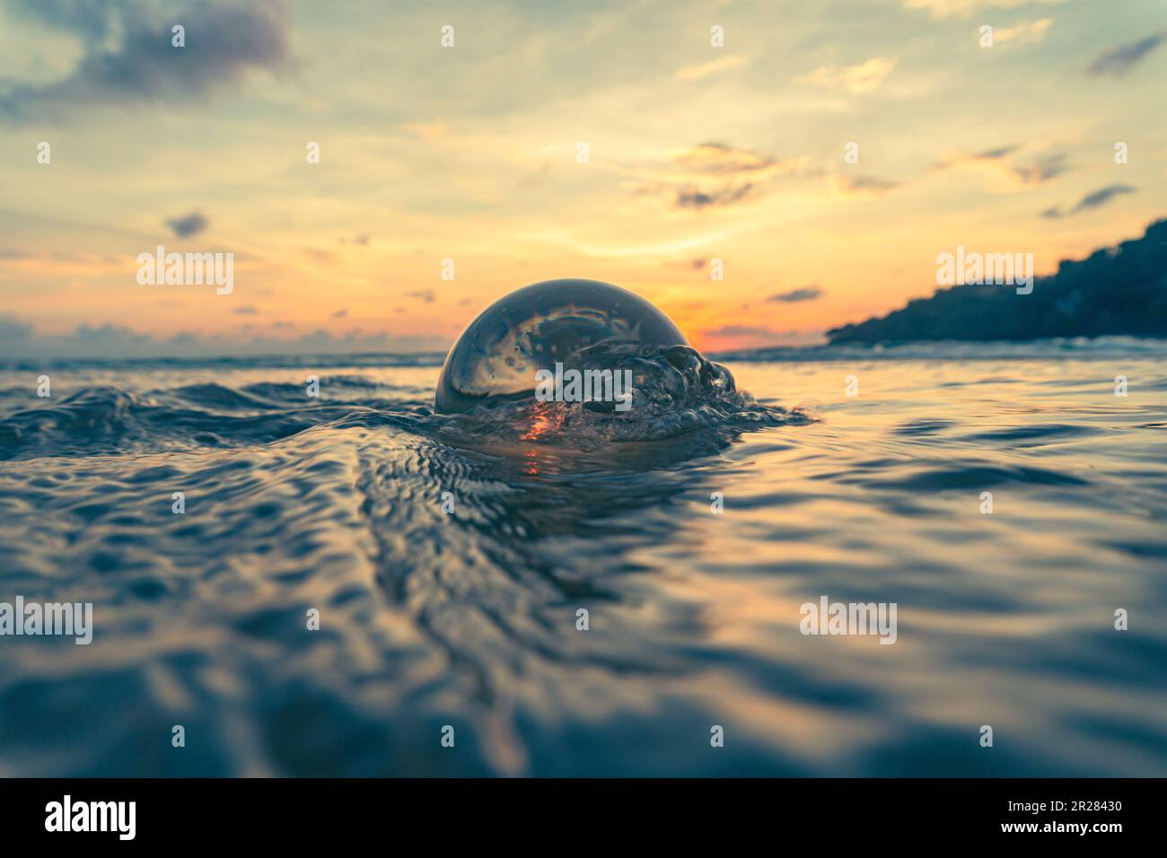 amazing view of beautiful sky at sunset inside crystal ball. colorful ...