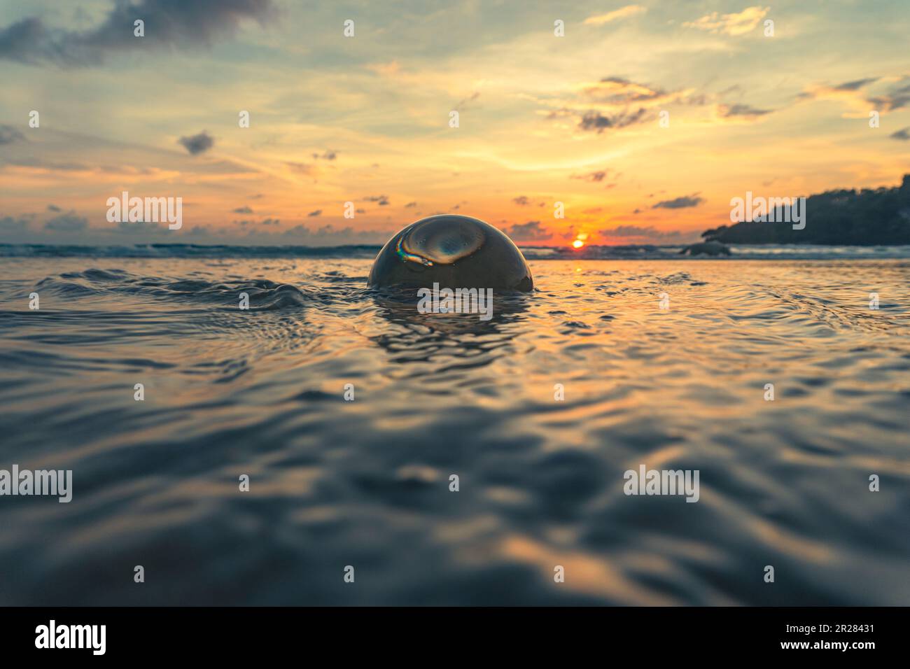 amazing view of beautiful sky at sunset inside crystal ball. colorful ...
