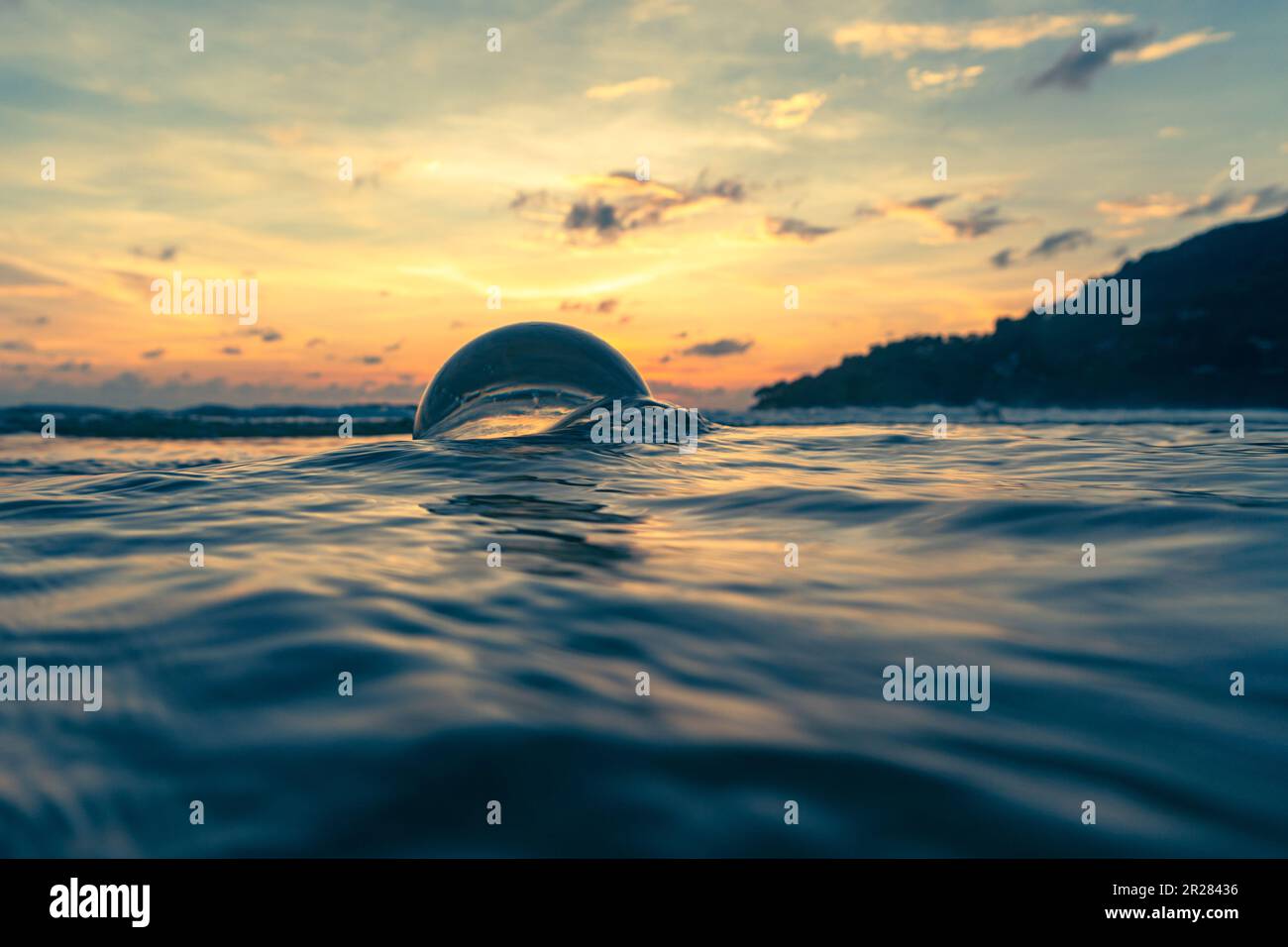 amazing view of beautiful sky at sunset inside crystal ball. colorful ...