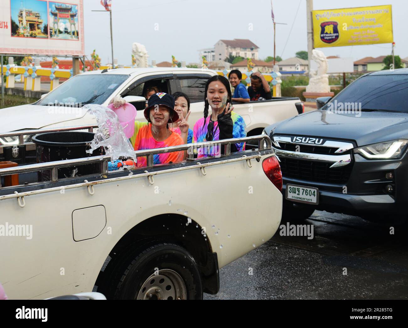 Local Thai people celebrating Songkran by splashing water from the back ...