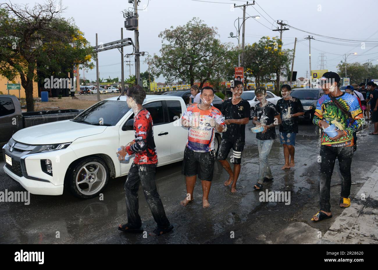 Local Thai people celebrating Songkran by splashing water from the back ...