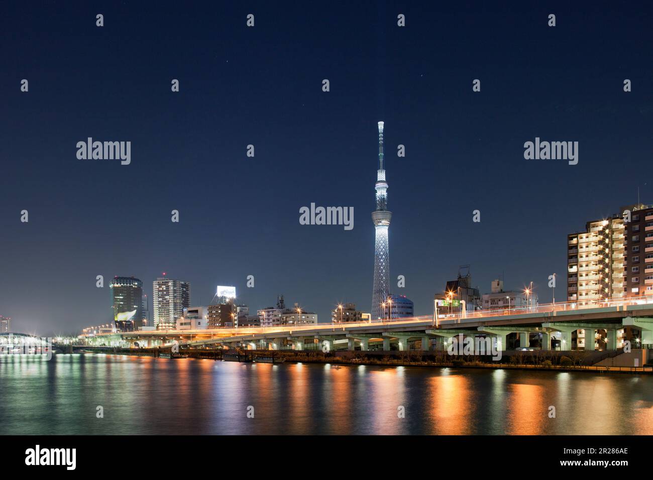 A night view of the light up of the sky tree towers and the skyscrapers ...