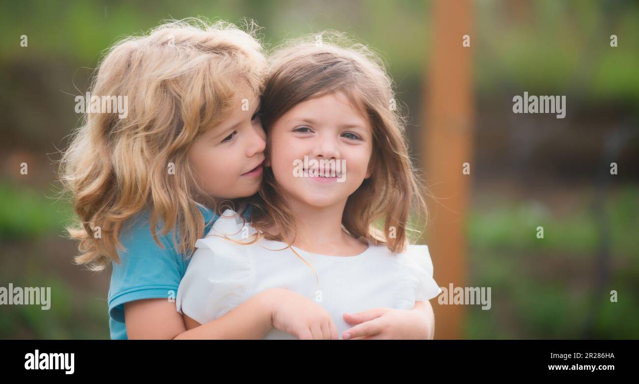 Little boy and girl best friends hugging. Kids kissing each other with ...