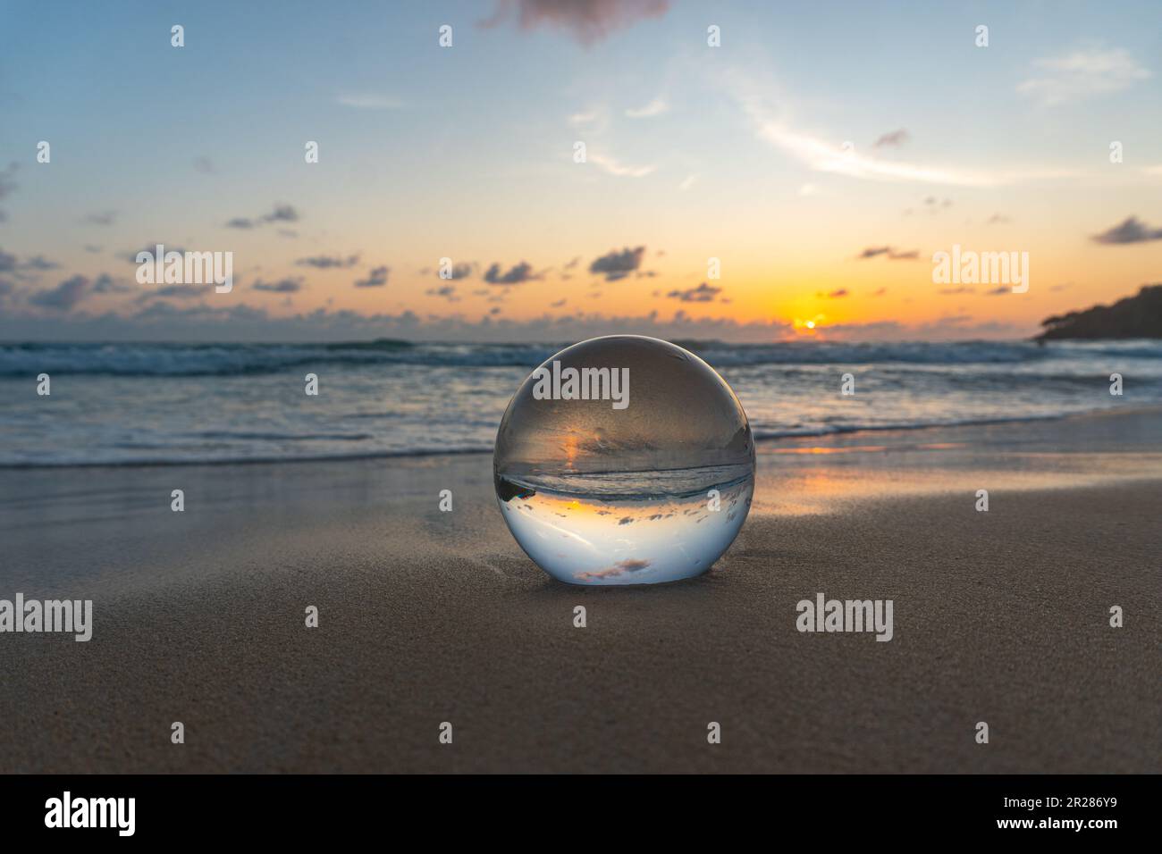 Magnificent sky above the crystal ball on the beach. The beautiful ...
