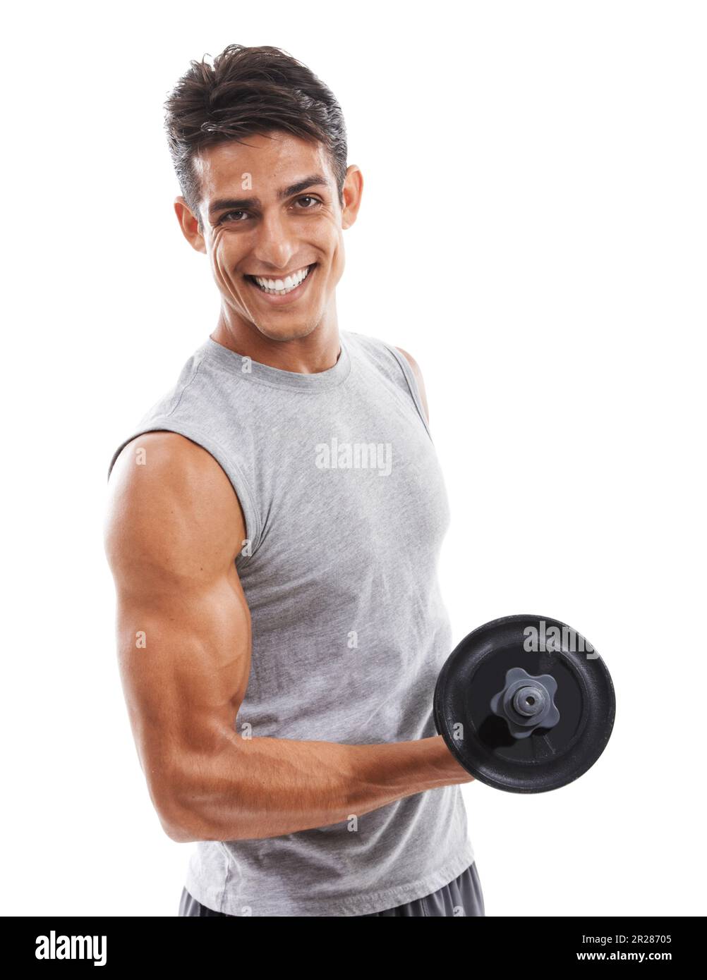 Dedicated to gyming. Portrait of a handsome young man lifting weights ...