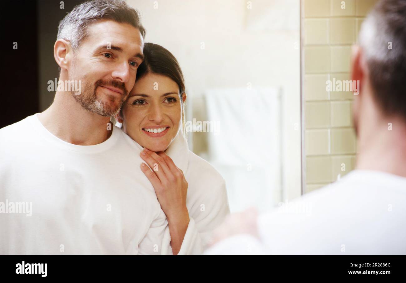 Home, love and couple in a bathroom, mirror and cleaning with hygiene ...