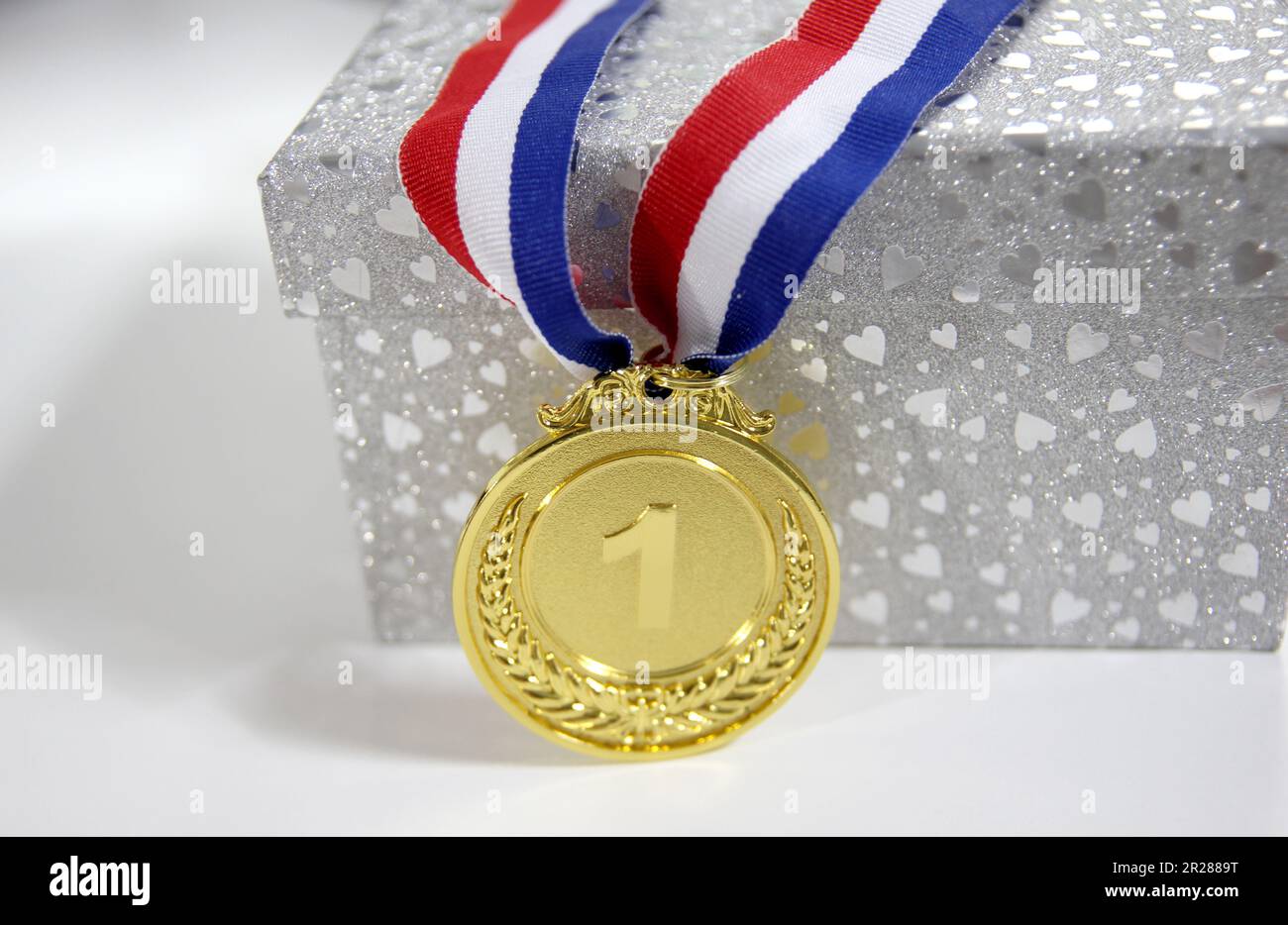 Gold medal 1 place with a ribbon on a light gray background, the ...