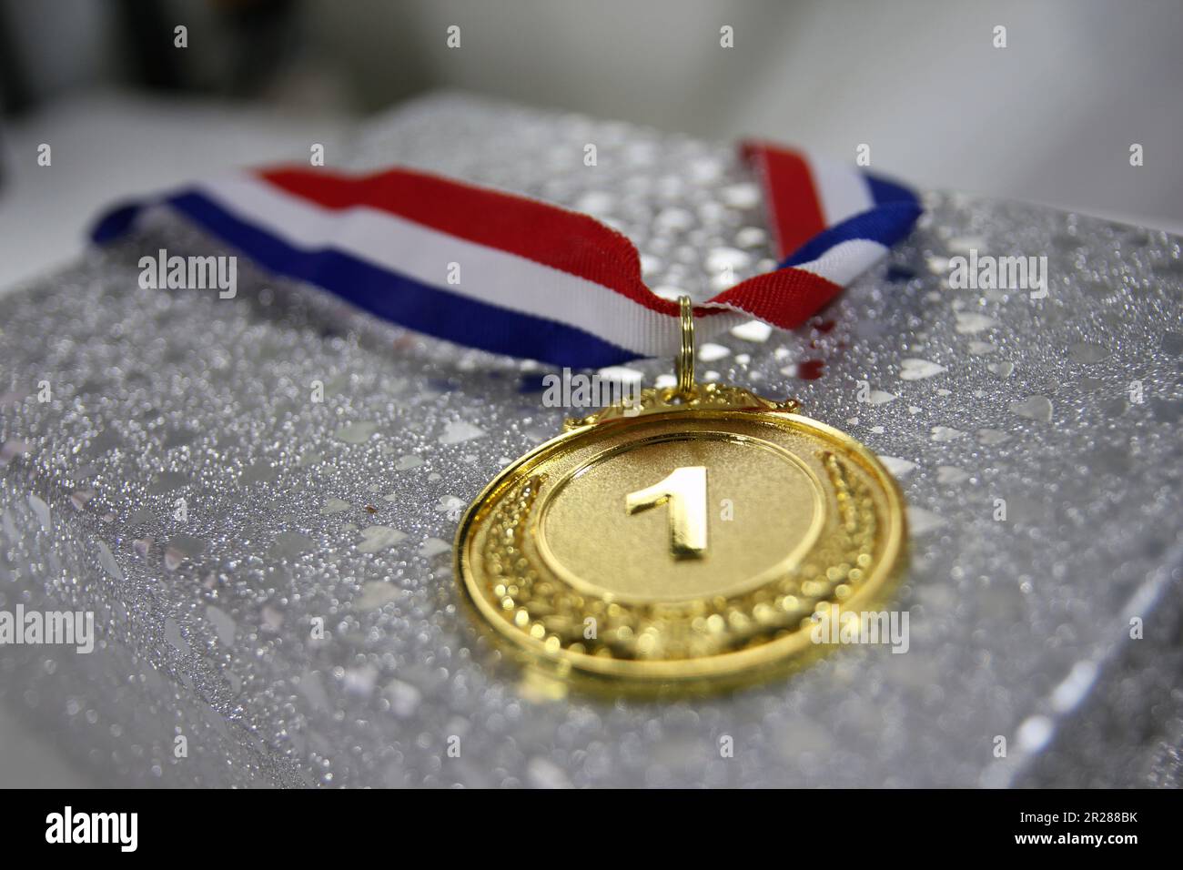 Gold medal 1 place with a ribbon on a light gray background, the ...